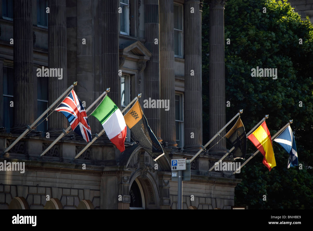A row of flags outside a hotel in the centre of Edinburgh, Scotland ...