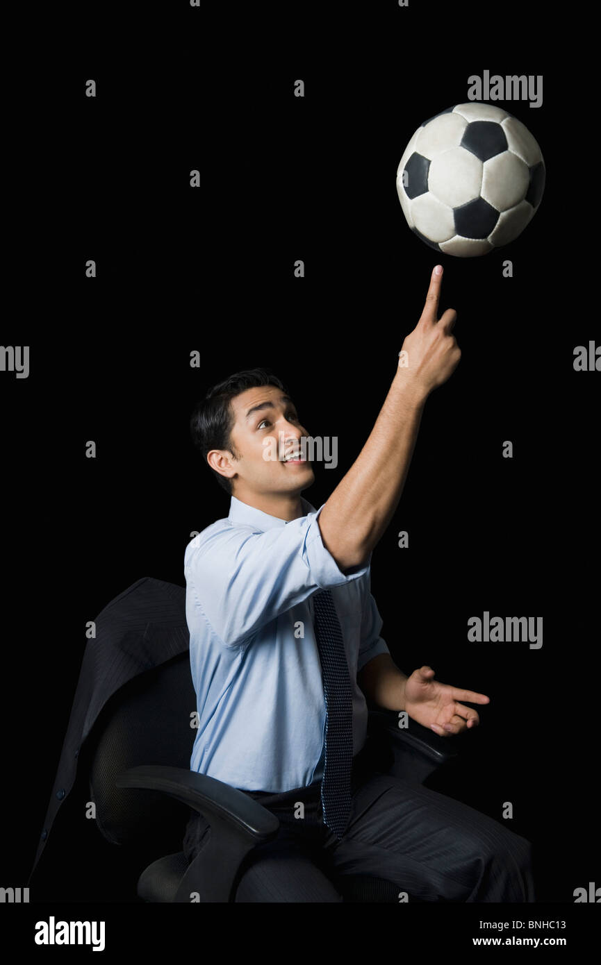 Man balancing on chair hi-res stock photography and images - Alamy