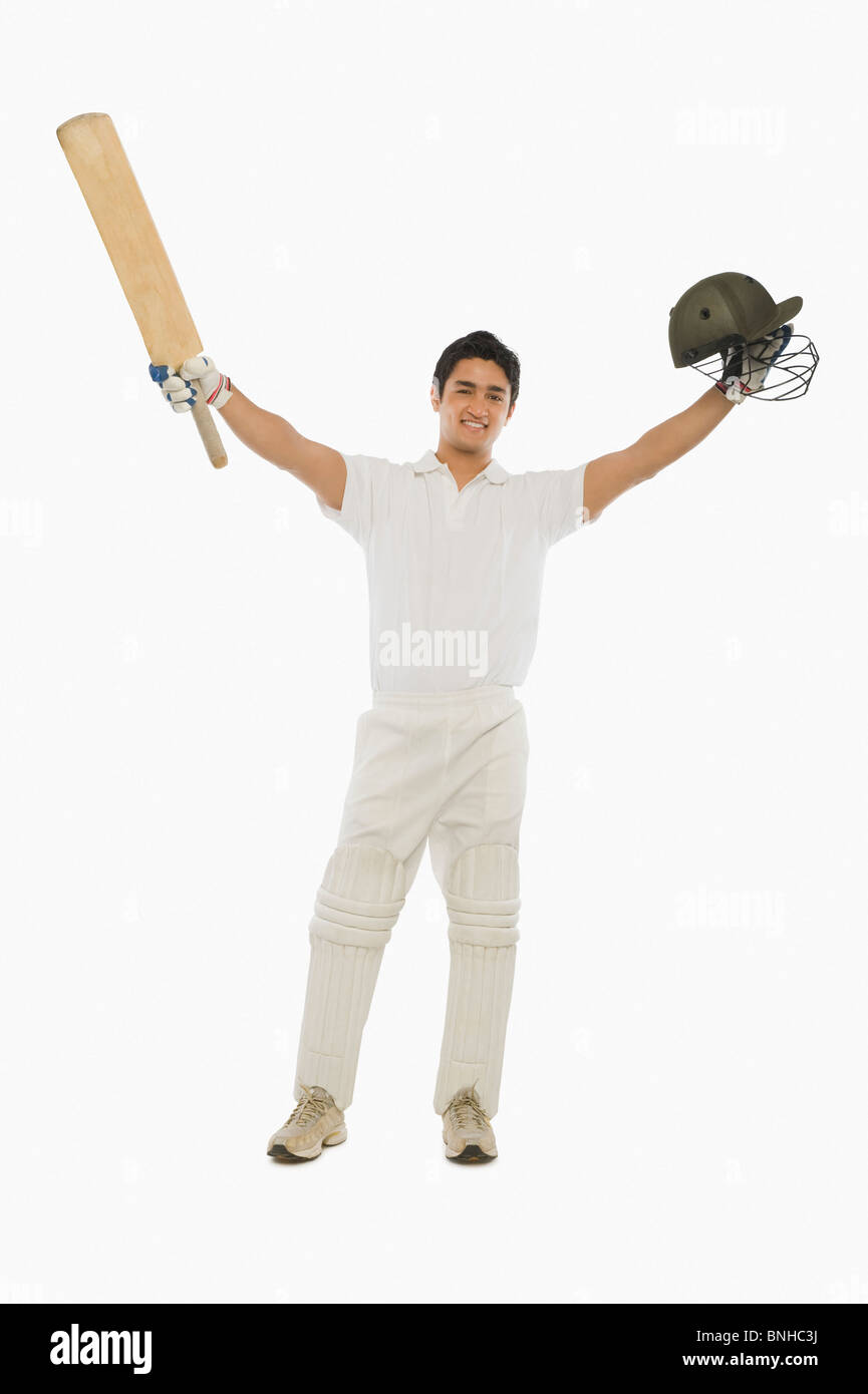 Portrait of a batsman celebrating his success Stock Photo - Alamy