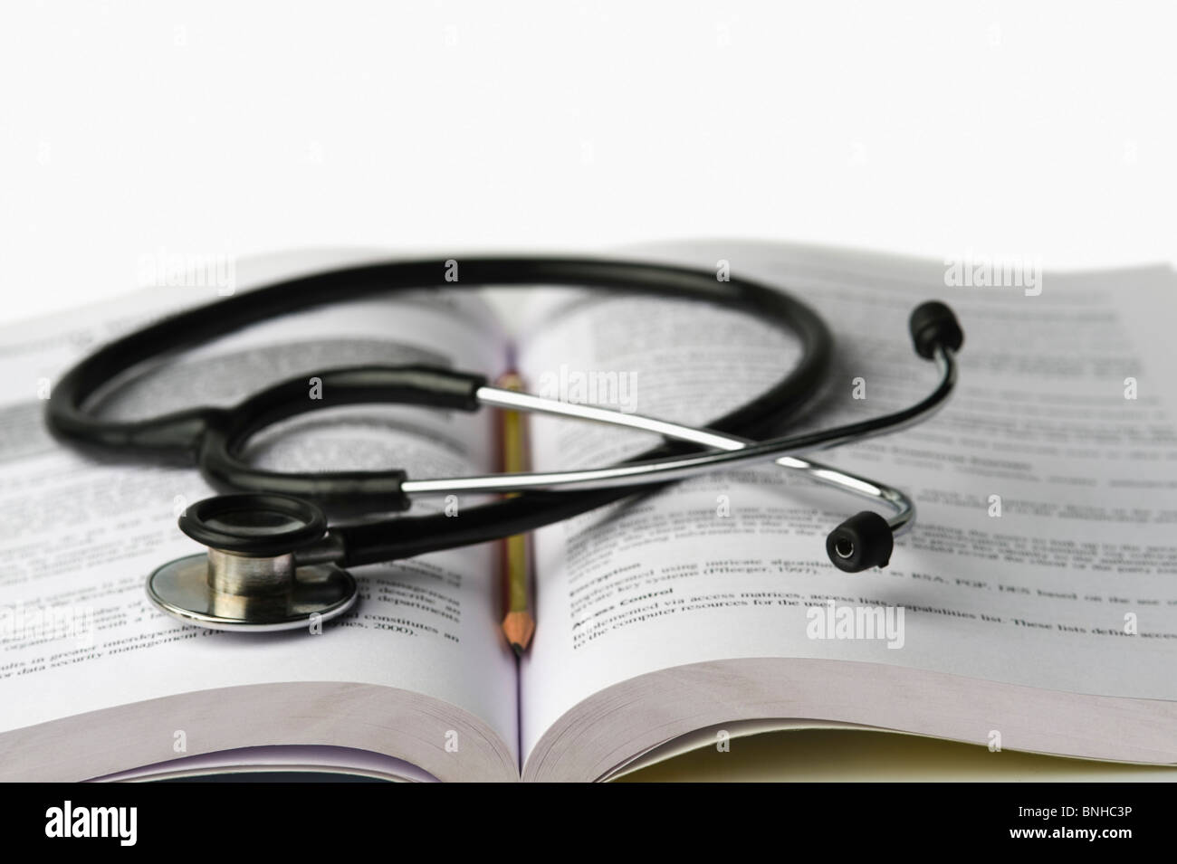 Close-up of a stethoscope on an open book Stock Photo - Alamy