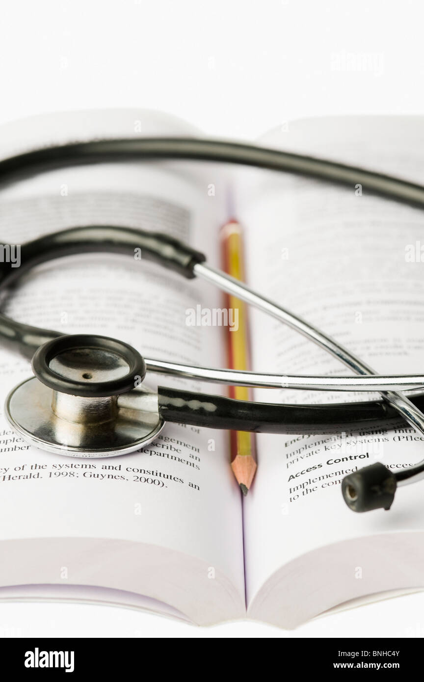 Close-up of a stethoscope on an open book Stock Photo - Alamy