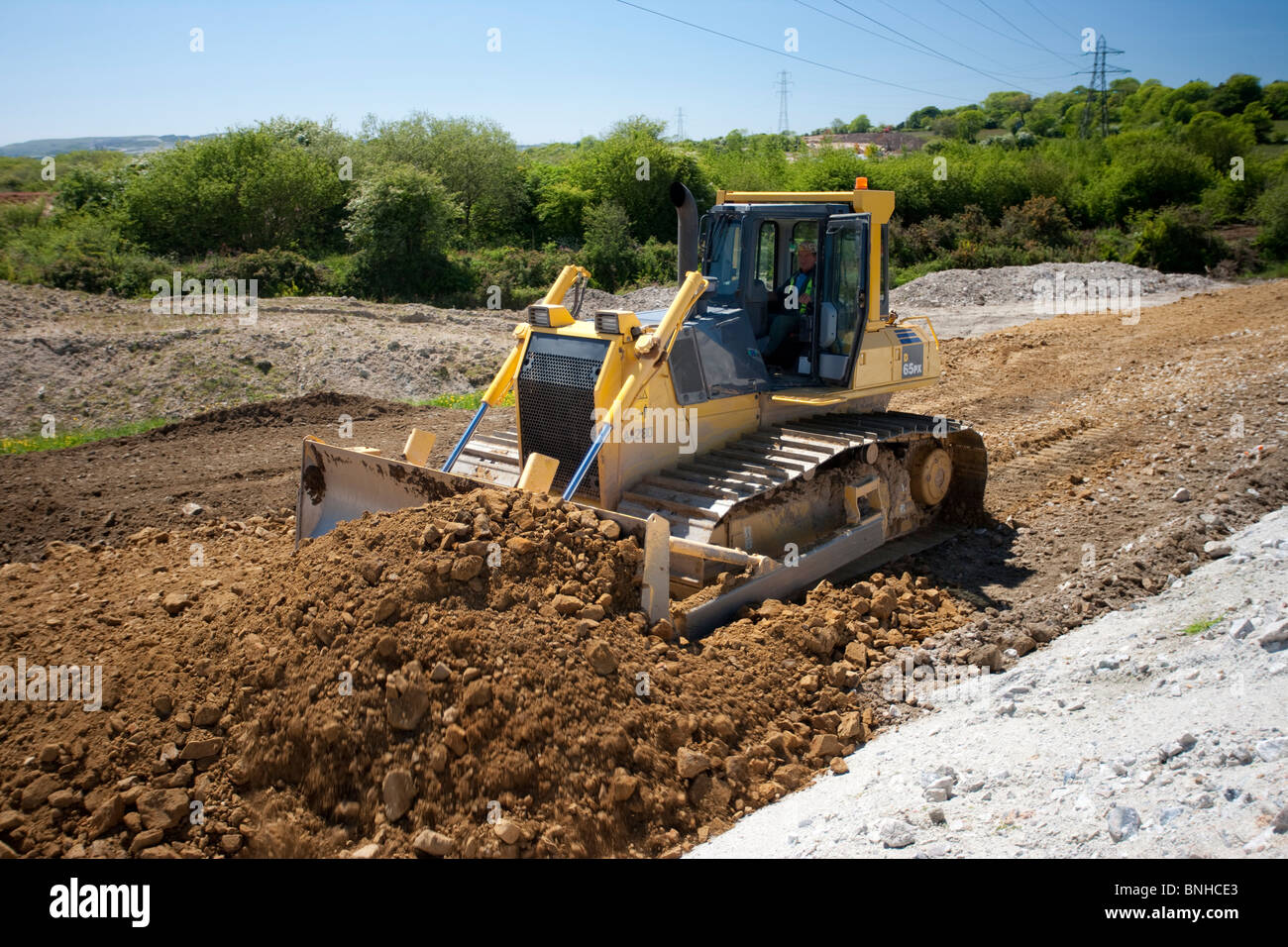Bulldozer on road construction site Stock Photo - Alamy