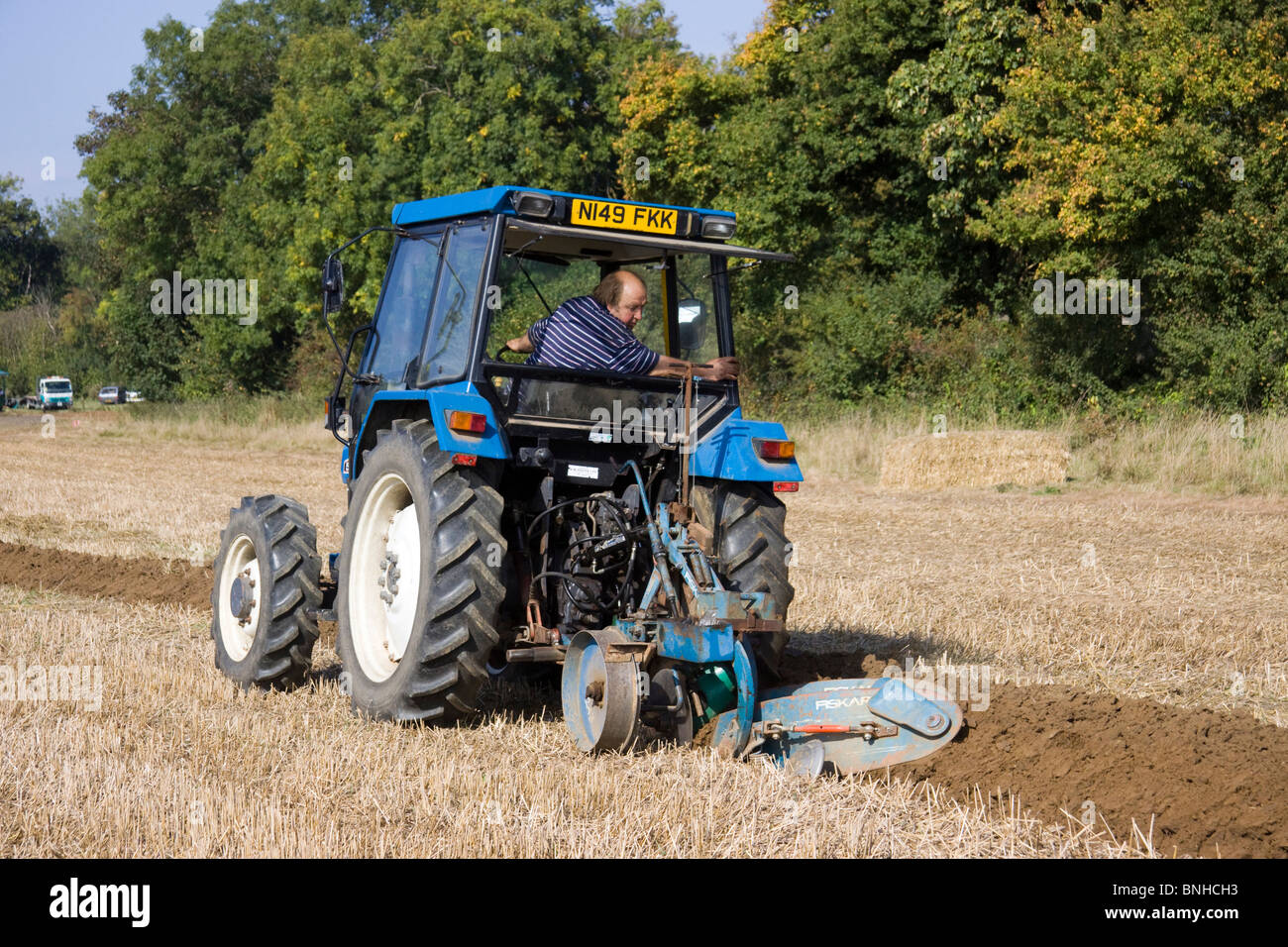 Old fashioned tractor ploughing field hi-res stock photography and ...
