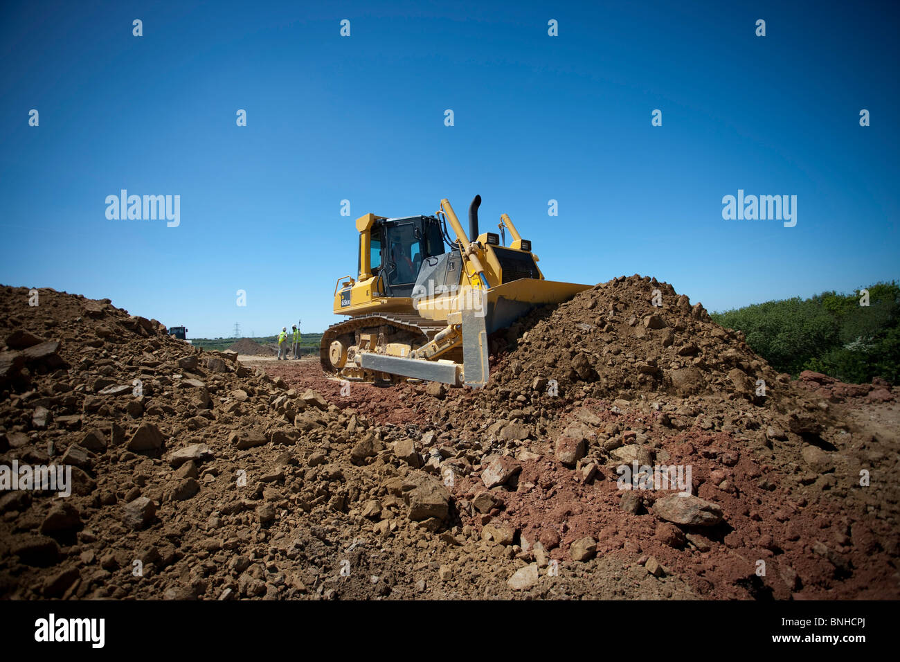 Bulldozer on road construction site Stock Photo - Alamy