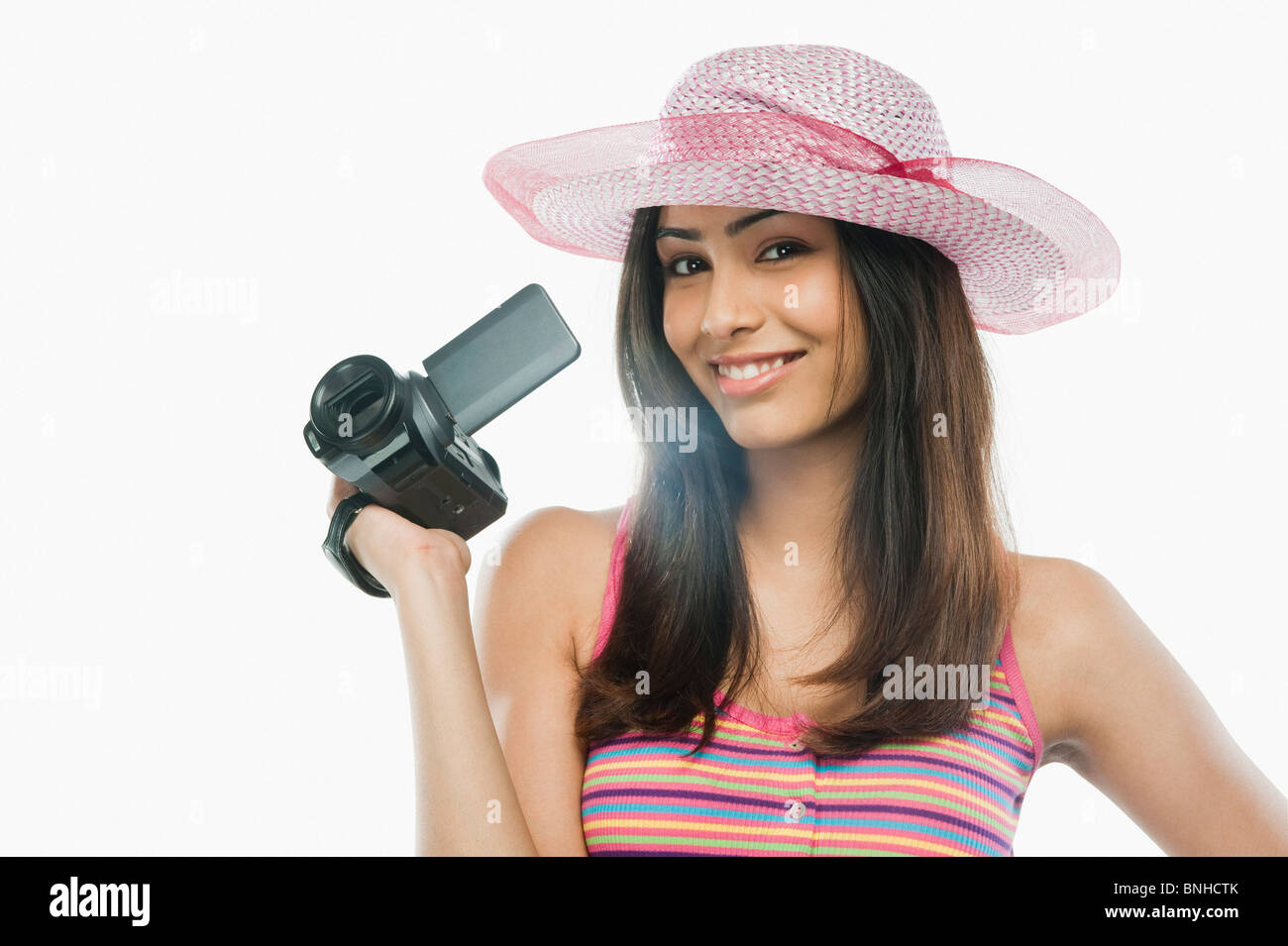 Portrait of a woman filming with a home video camera Stock Photo - Alamy