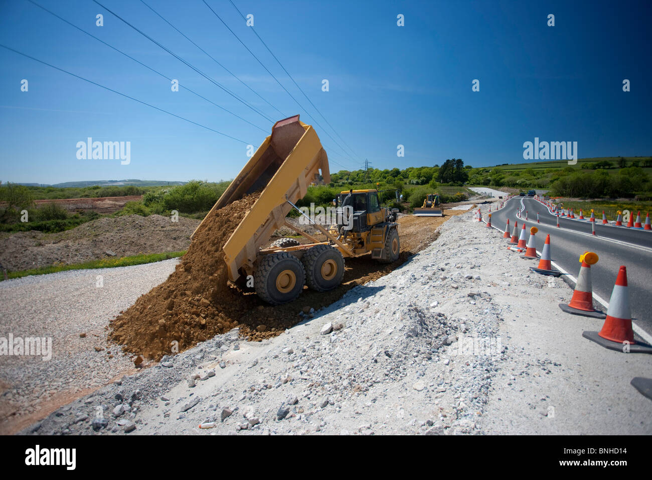 Articulated earth mover road construction Stock Photo - Alamy