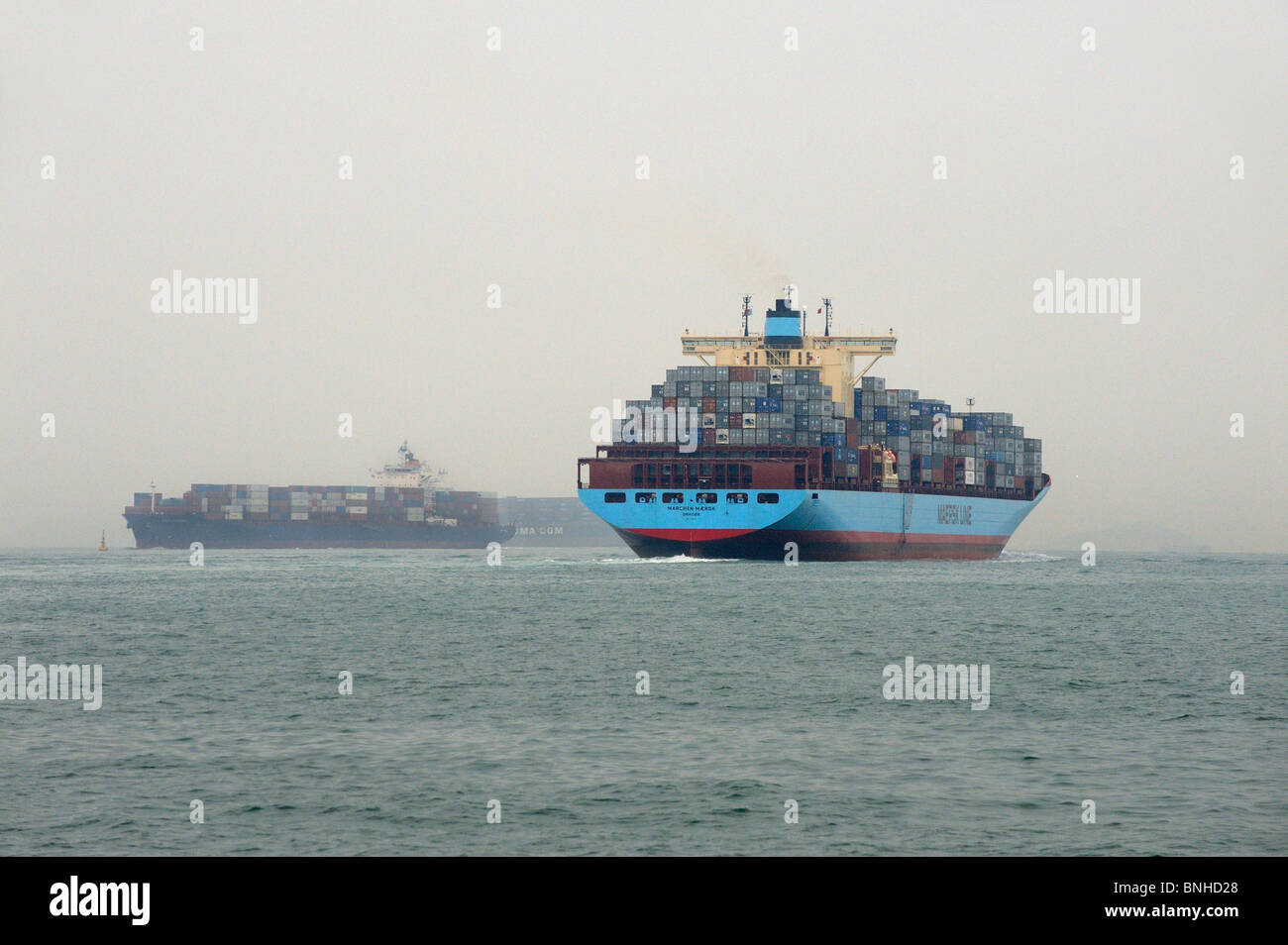 Hong Kong, Container ship from Maersk moving through the Lamma Channel ...