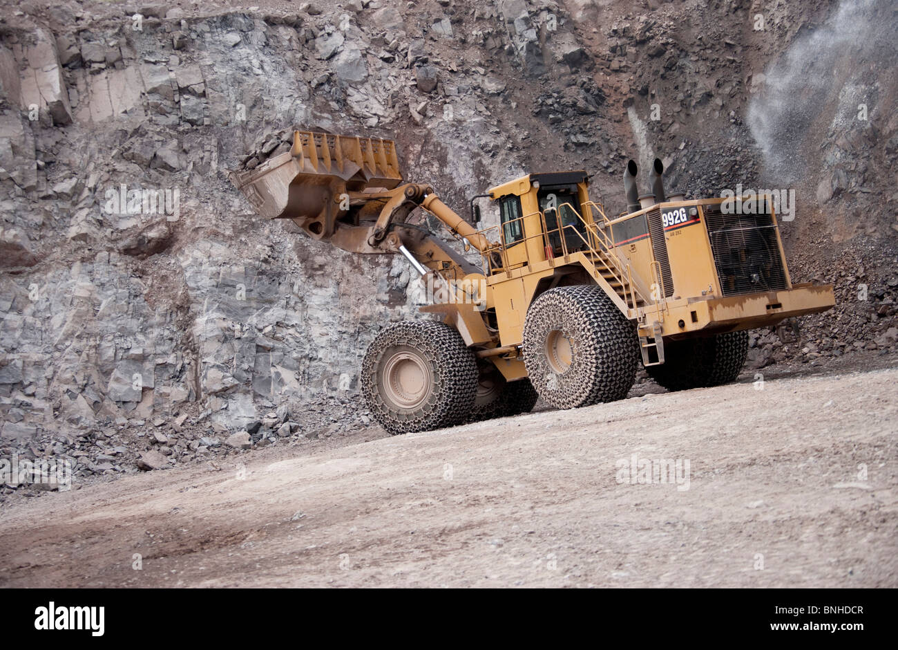 Large wheel dozer in open cast mine Stock Photo - Alamy