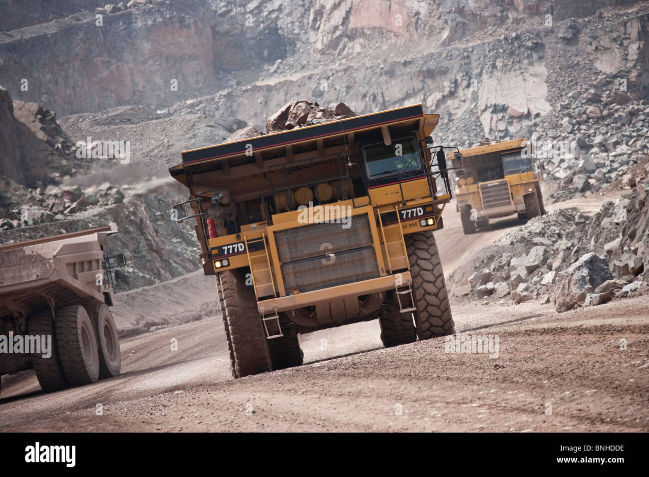 Large earth mover haul dump trucks in quarry Stock Photo - Alamy