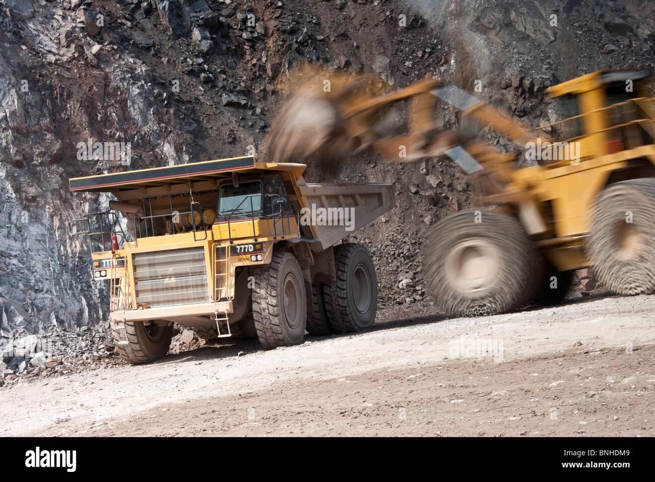 Large wheel dozer in open cast mine Stock Photo - Alamy