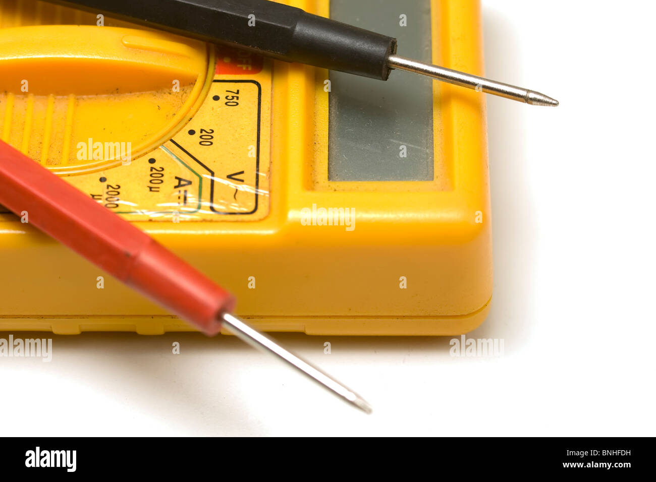 Yellow multimeter with testing needles Stock Photo - Alamy