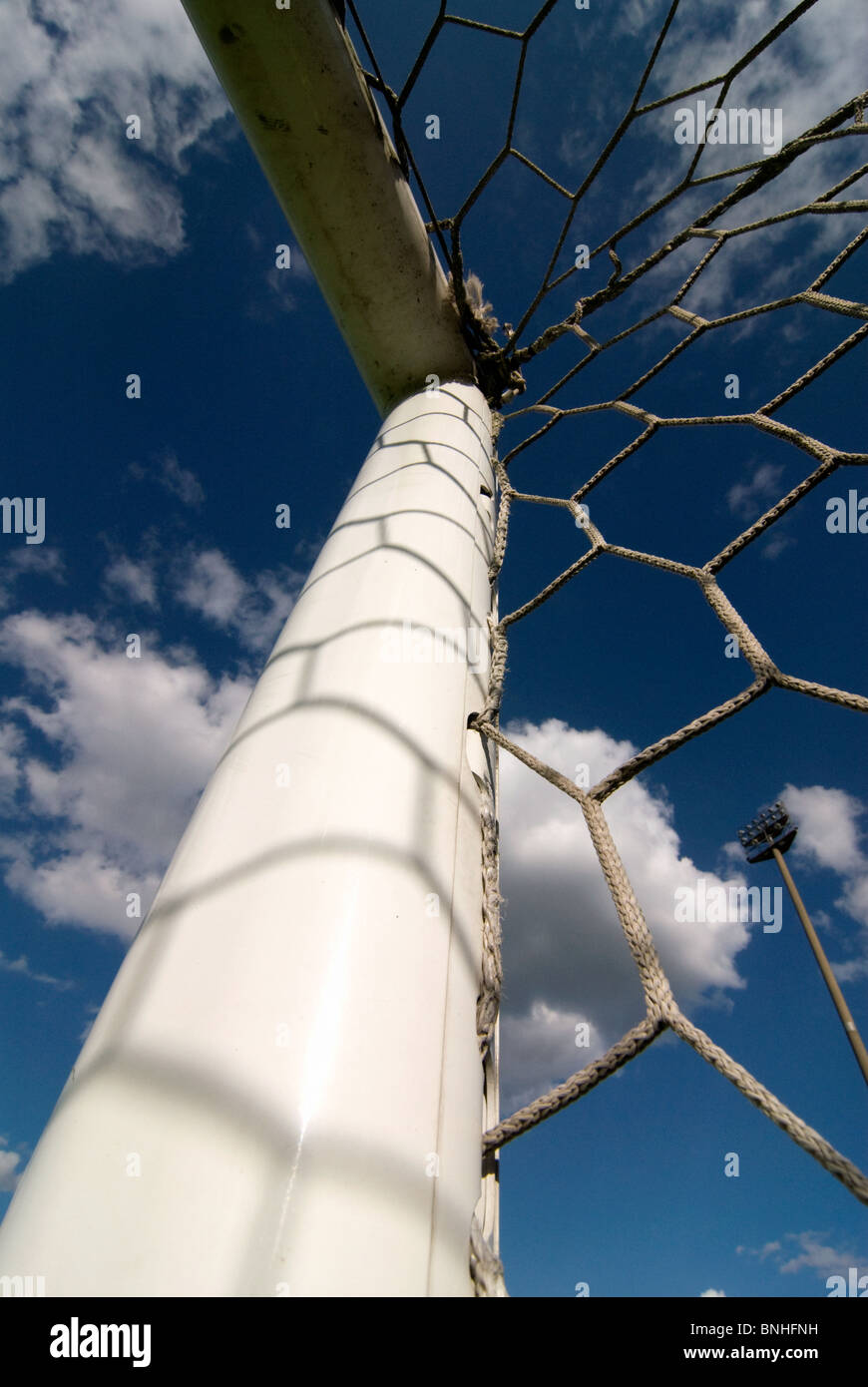 Detail of a football goal with blue sky and white clouds Stock Photo ...