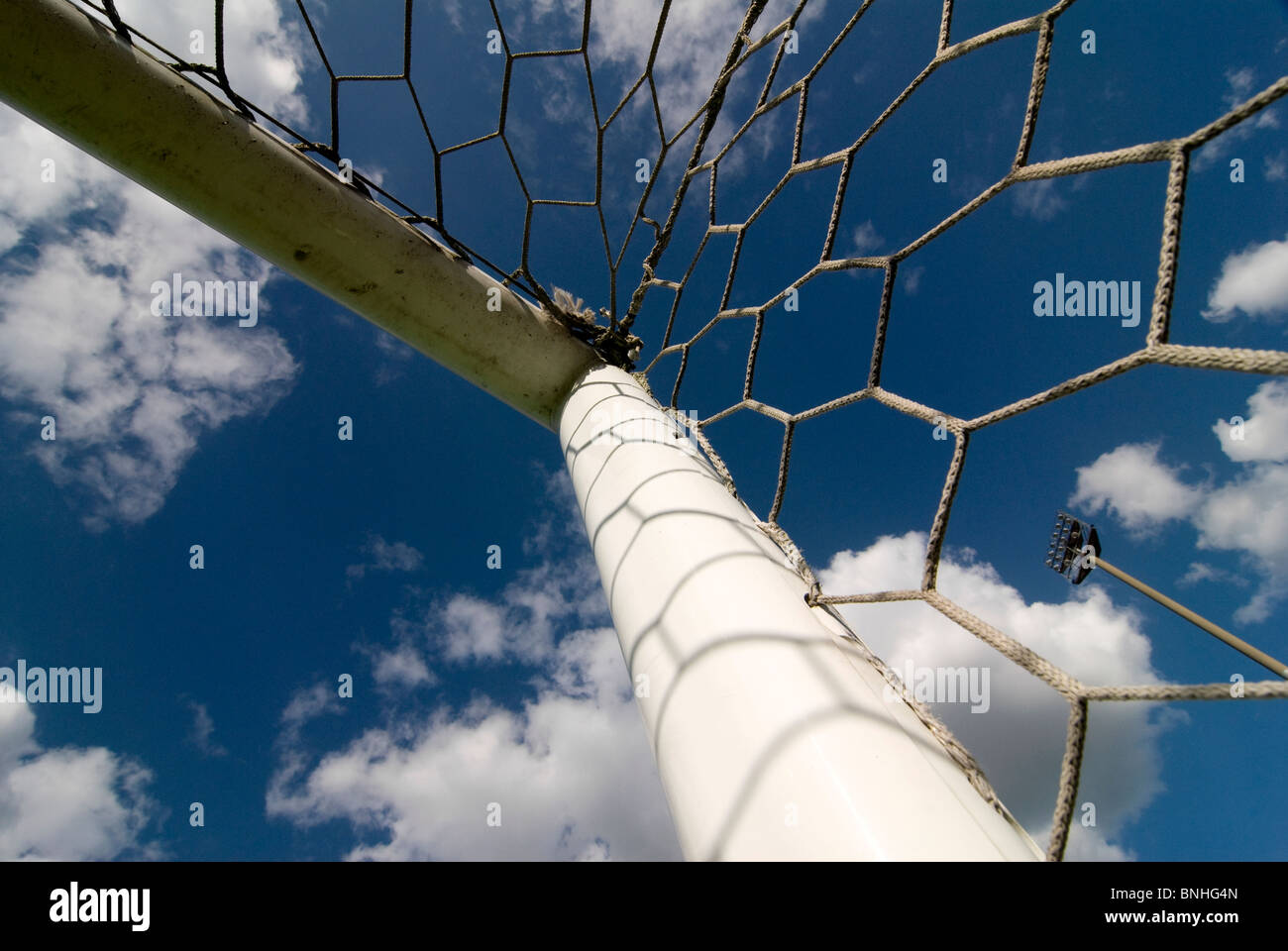 Detail of a football goal with blue sky and white clouds Stock Photo ...