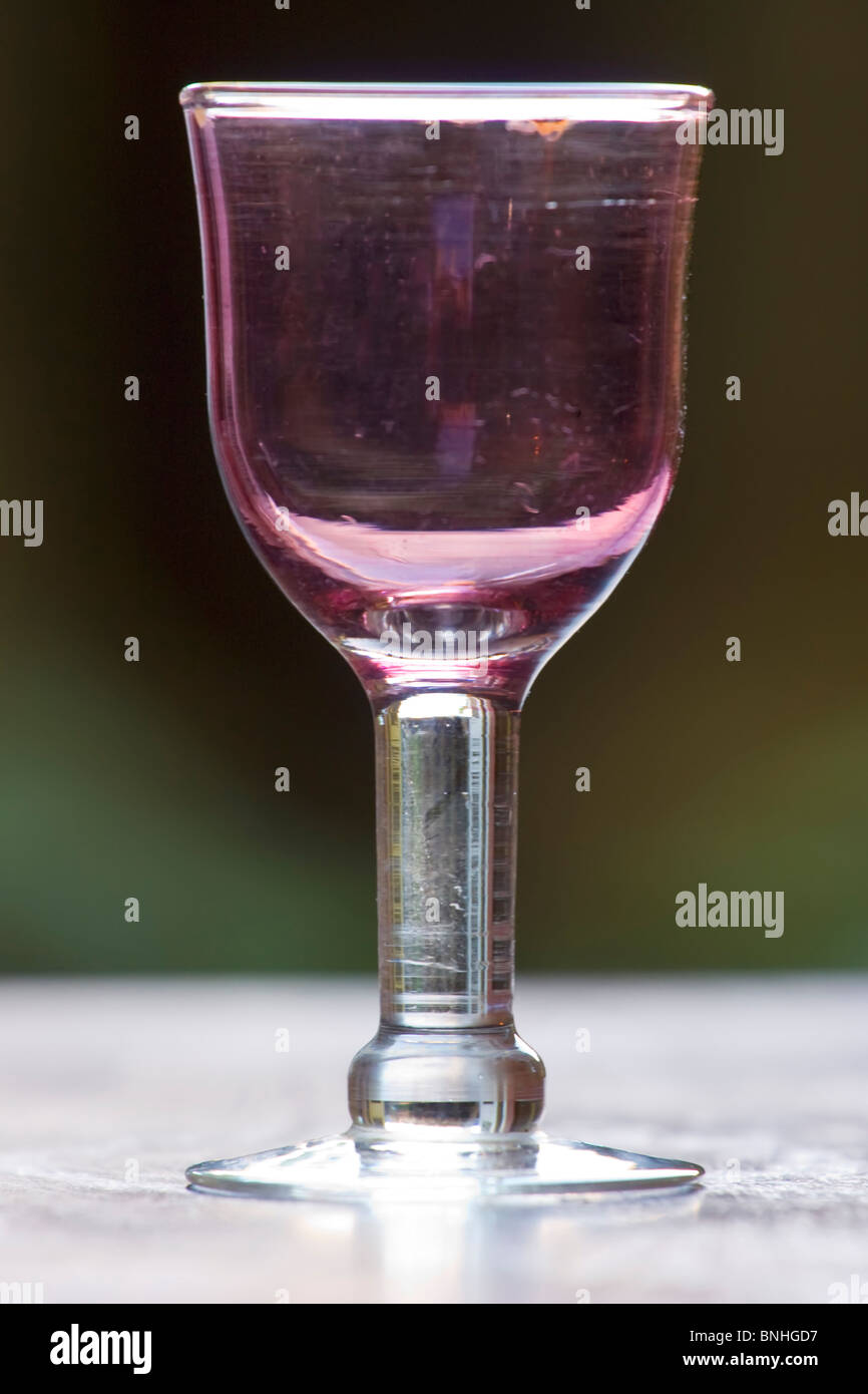 A pink glass liquor backlit Stock Photo - Alamy
