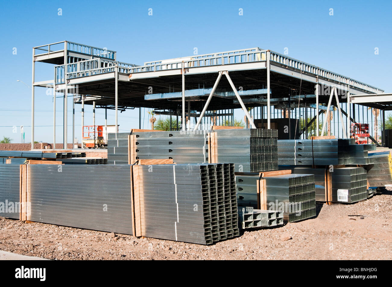 Steel beams are stacked on the construction site for a commercial ...