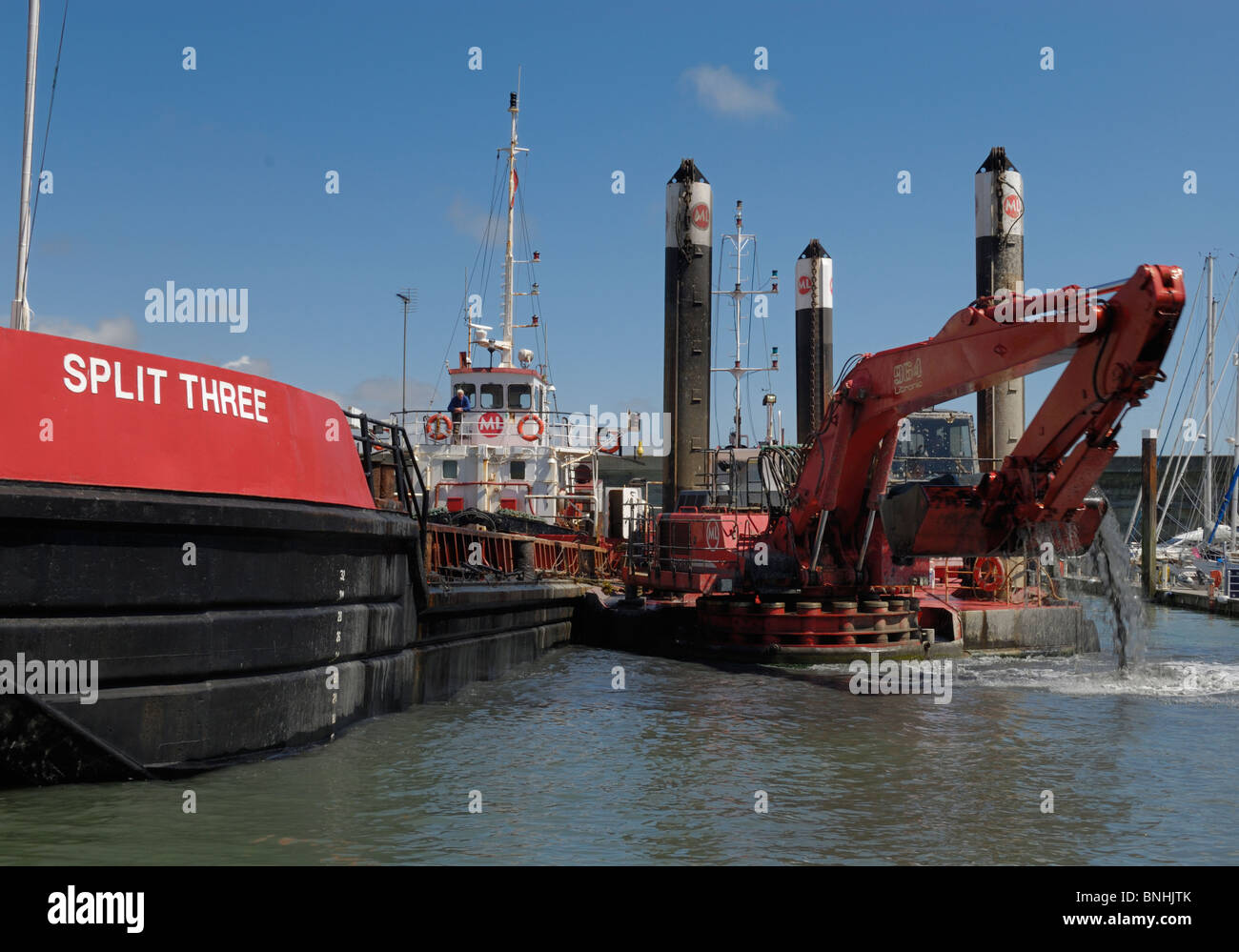 The dredger "Split Three" dredging in a marina, England Stock Photo - Alamy
