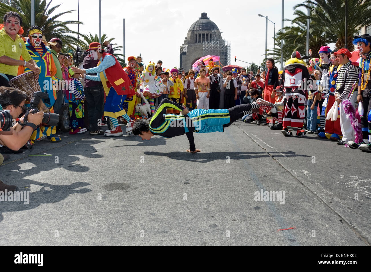 Clown breakdancing during a clown parade in Mexico city with clowns ...