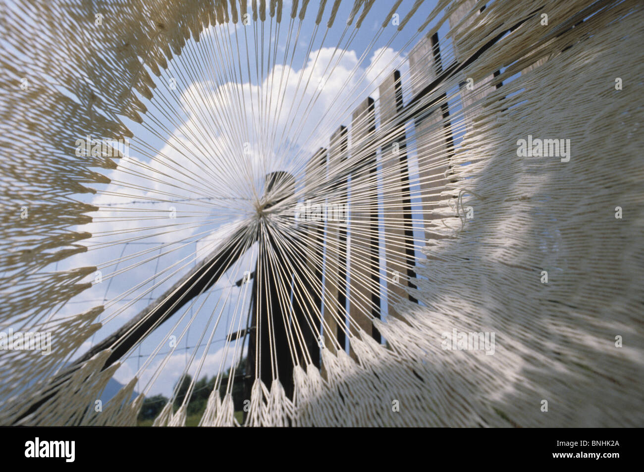 Hammock fabric sling ropes structure fence relaxing Stock Photo - Alamy