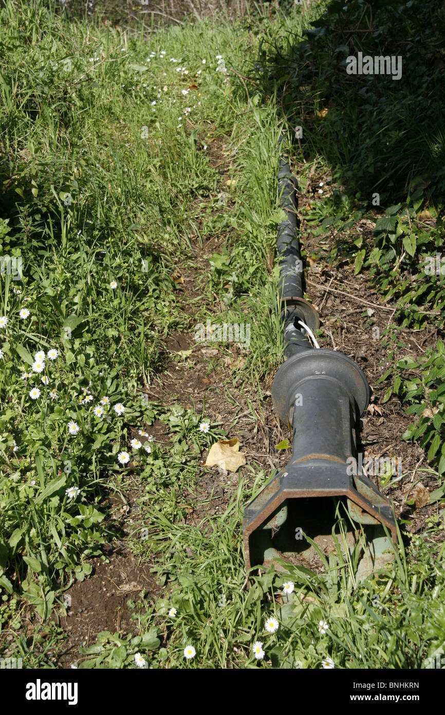 damaged street lamp light post pole left in field Stock Photo - Alamy