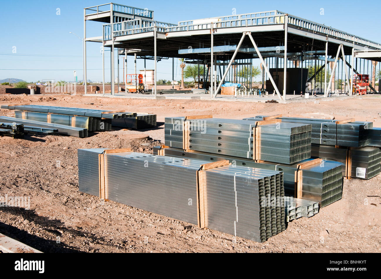 Steel beams are stacked on the construction site for a commercial ...