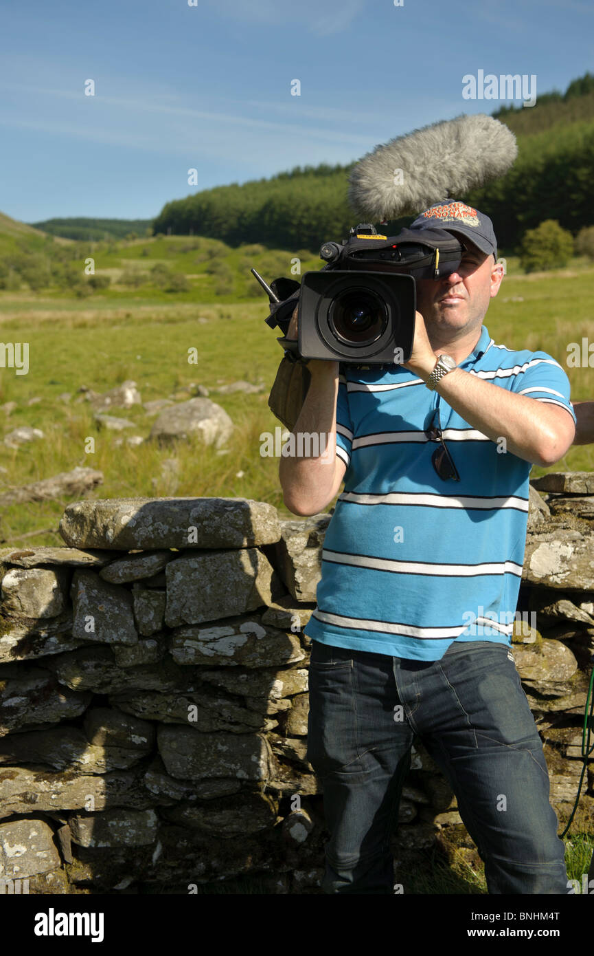 Video cameraman making a television programme, Wales UK Stock Photo - Alamy