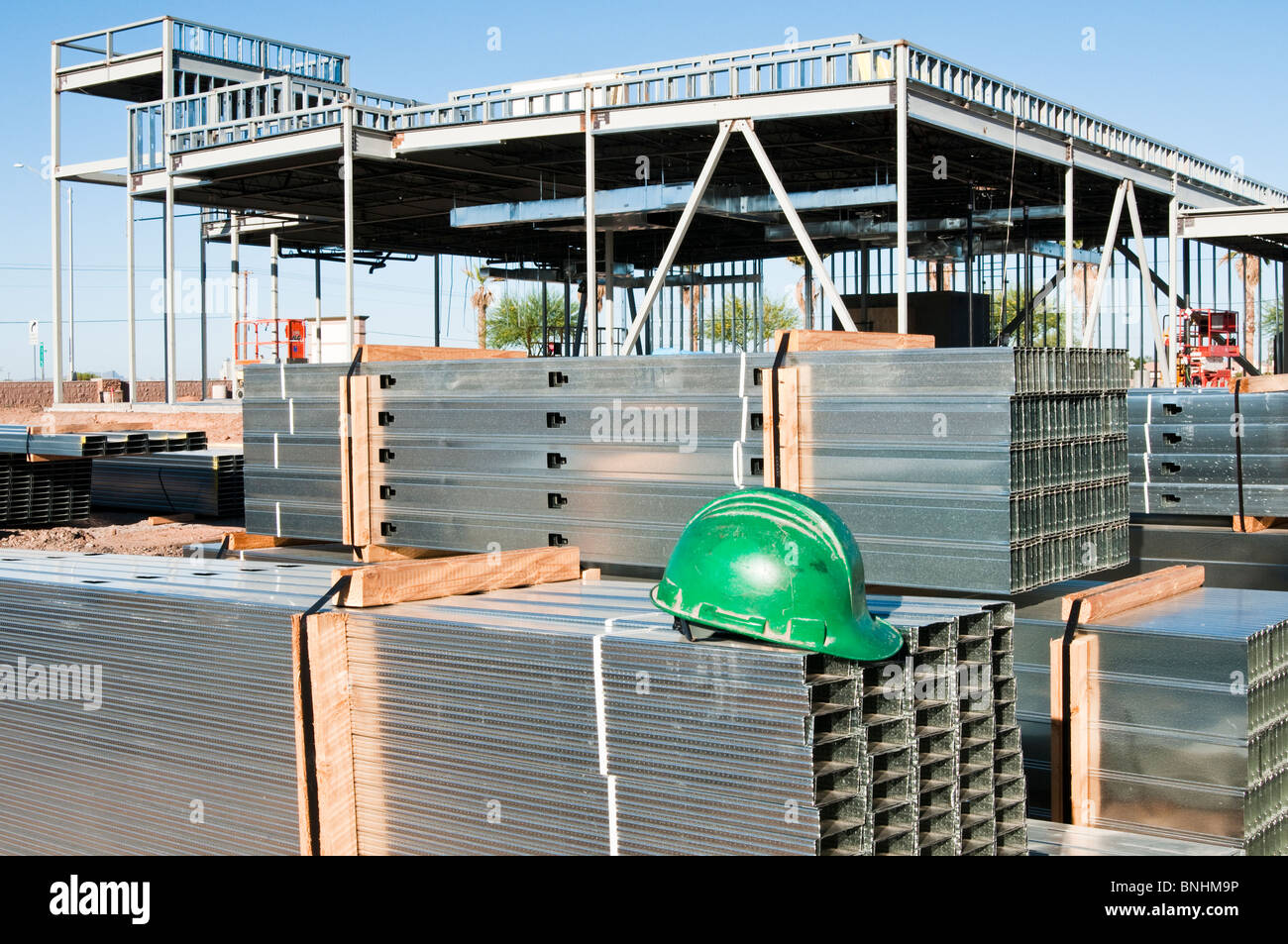 Steel beams are stacked on the construction site of a commercial ...