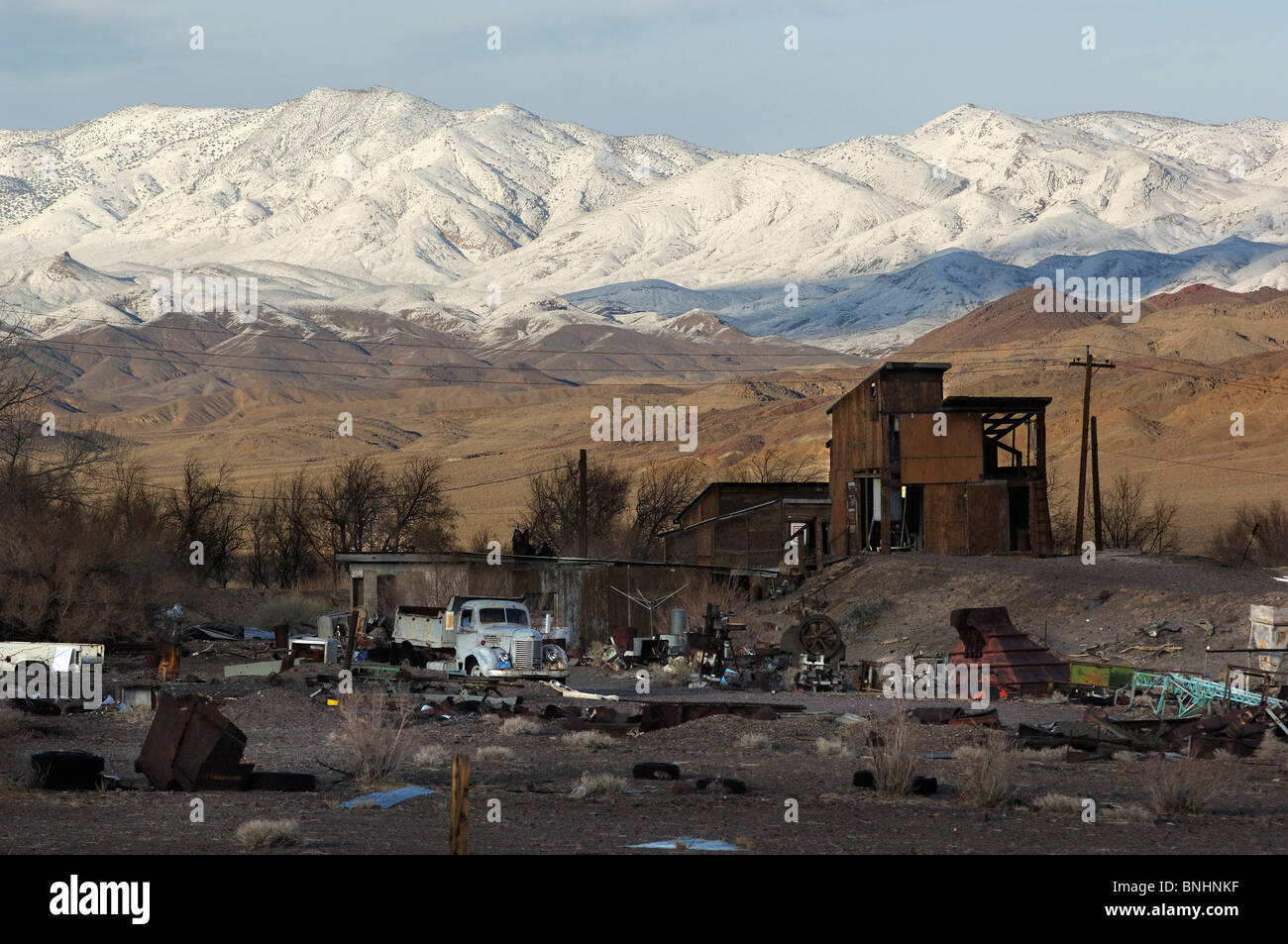 USA Sierra Nevada Coaldale Nevada Snow covered scrap buildings wrecks ...