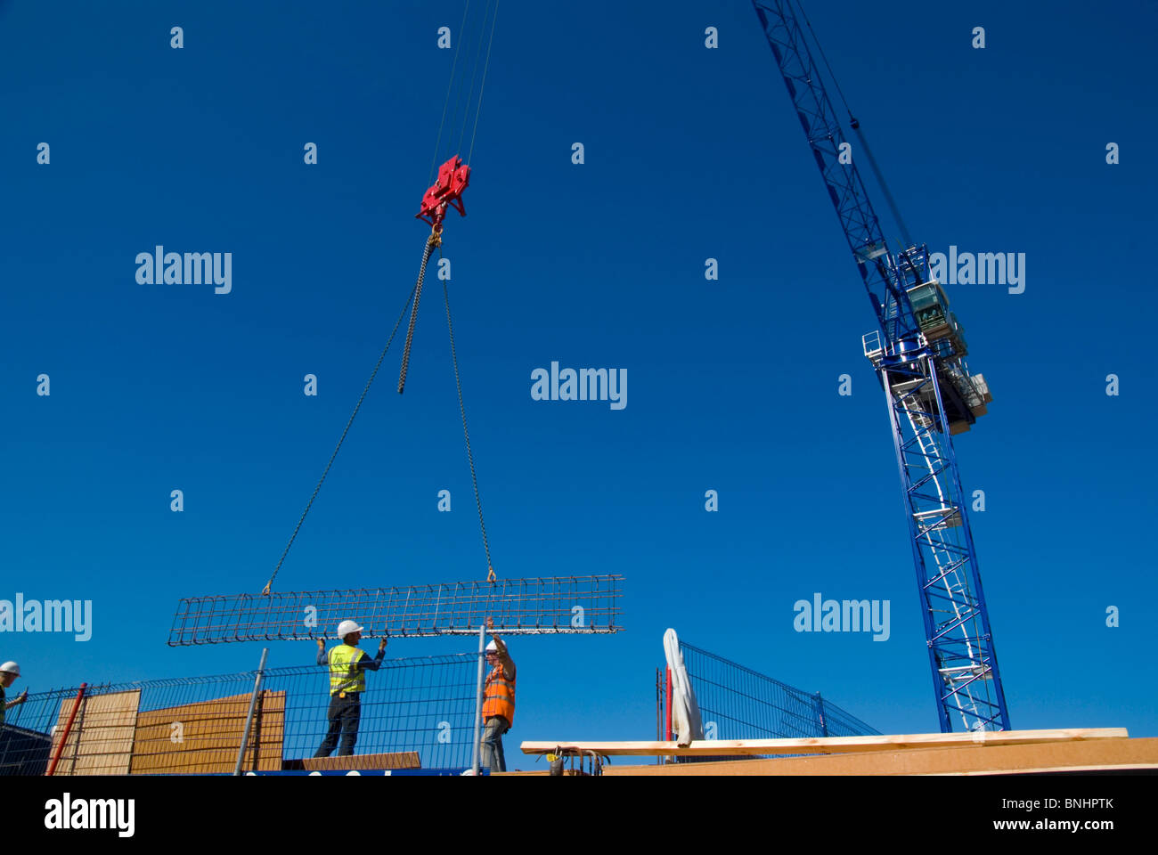 London cantilever crane construction site UK lift load move building ...