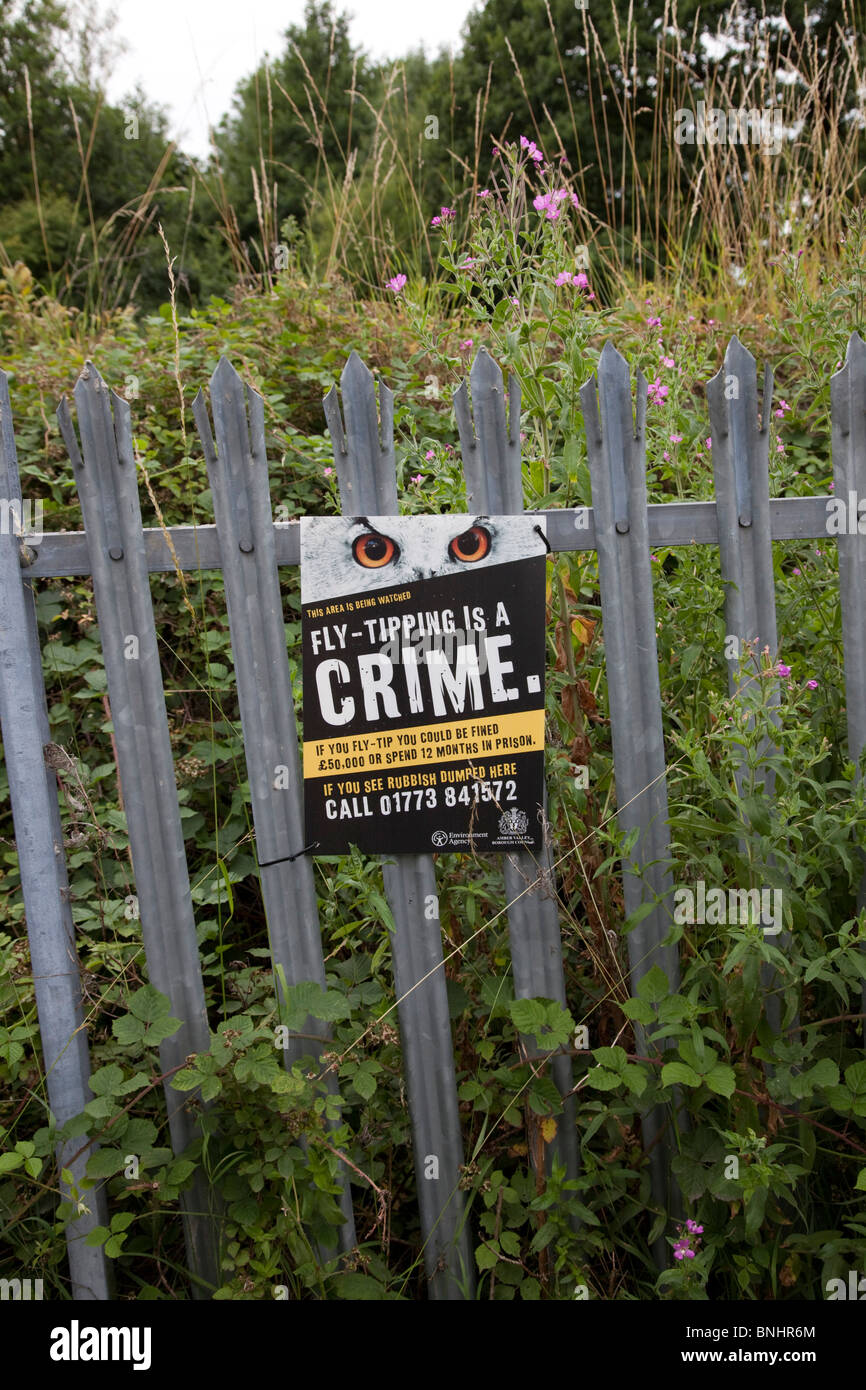 no fly tipping sign on railings Stock Photo - Alamy