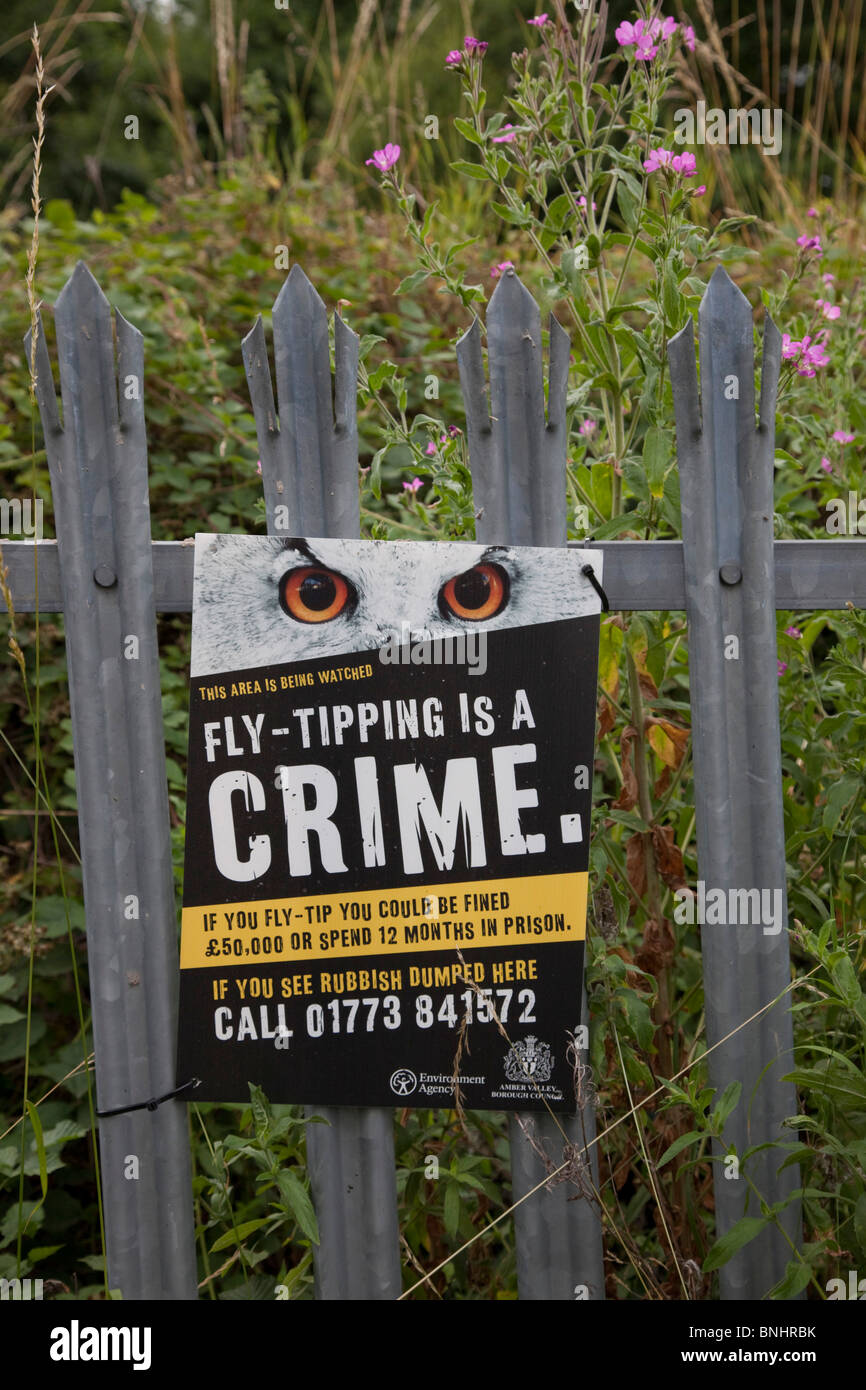 no fly tipping sign on railings Stock Photo - Alamy