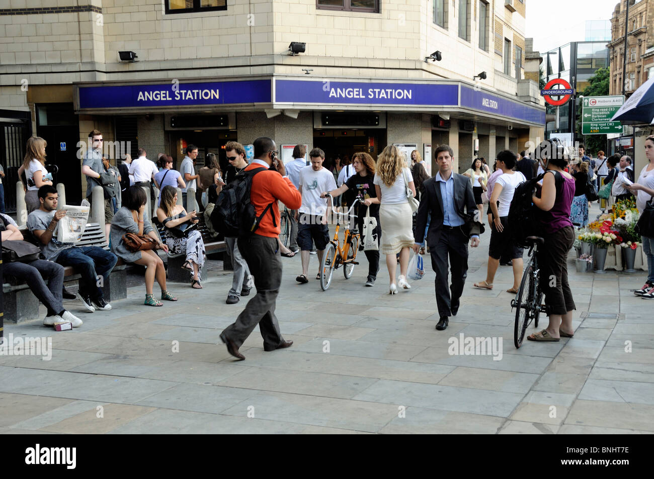 Busy street scene outside Angel Station Islington London England UK ...
