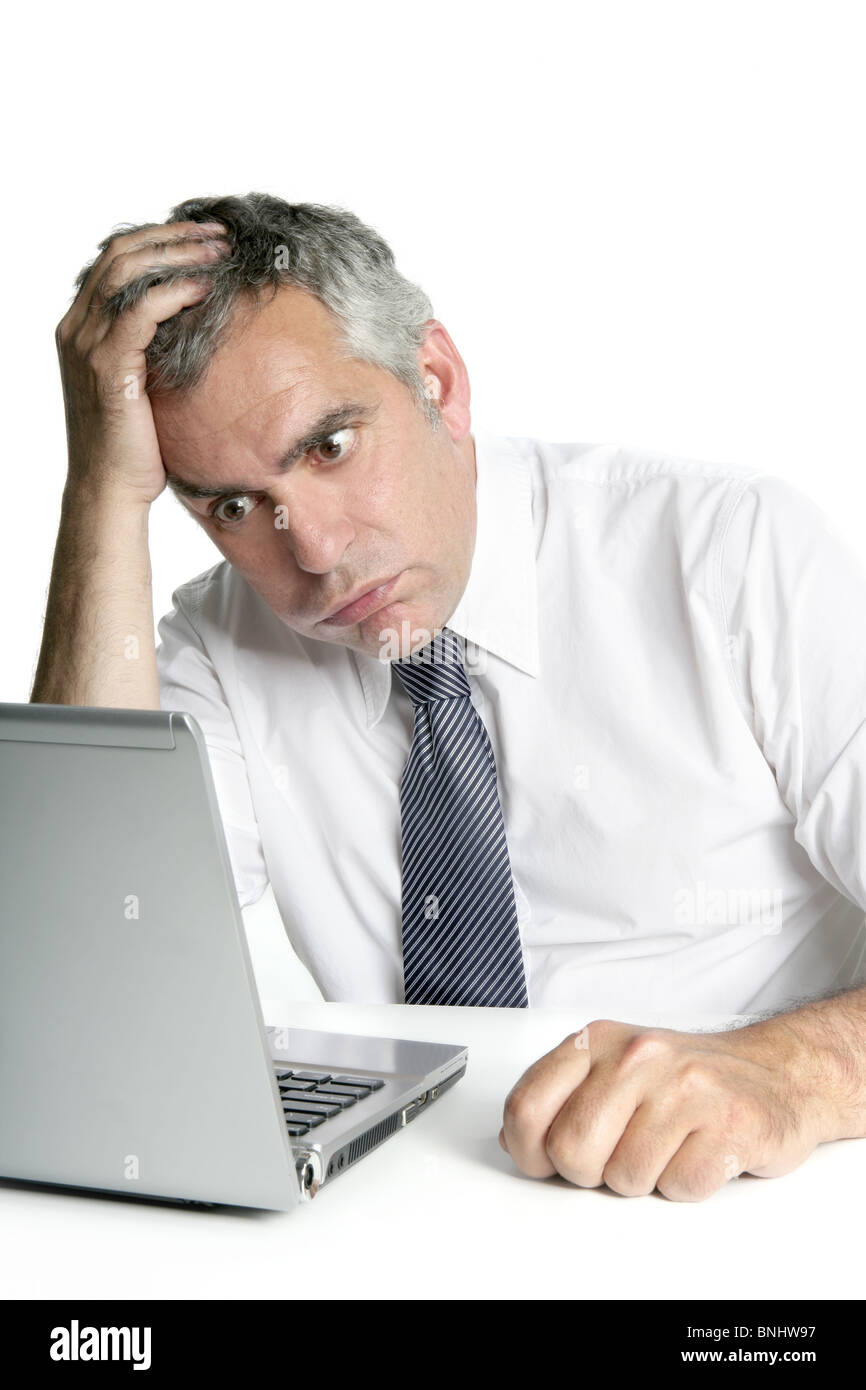 stressed senior businessman gesture working laptop computer white desk ...