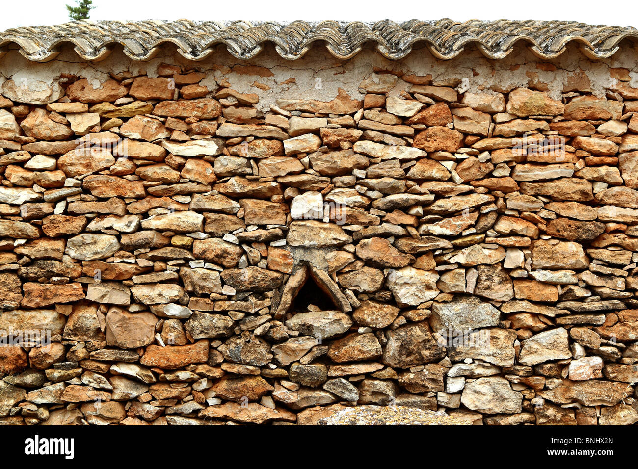 masonry stone wall triangle windows Formentera balearic islands Stock ...