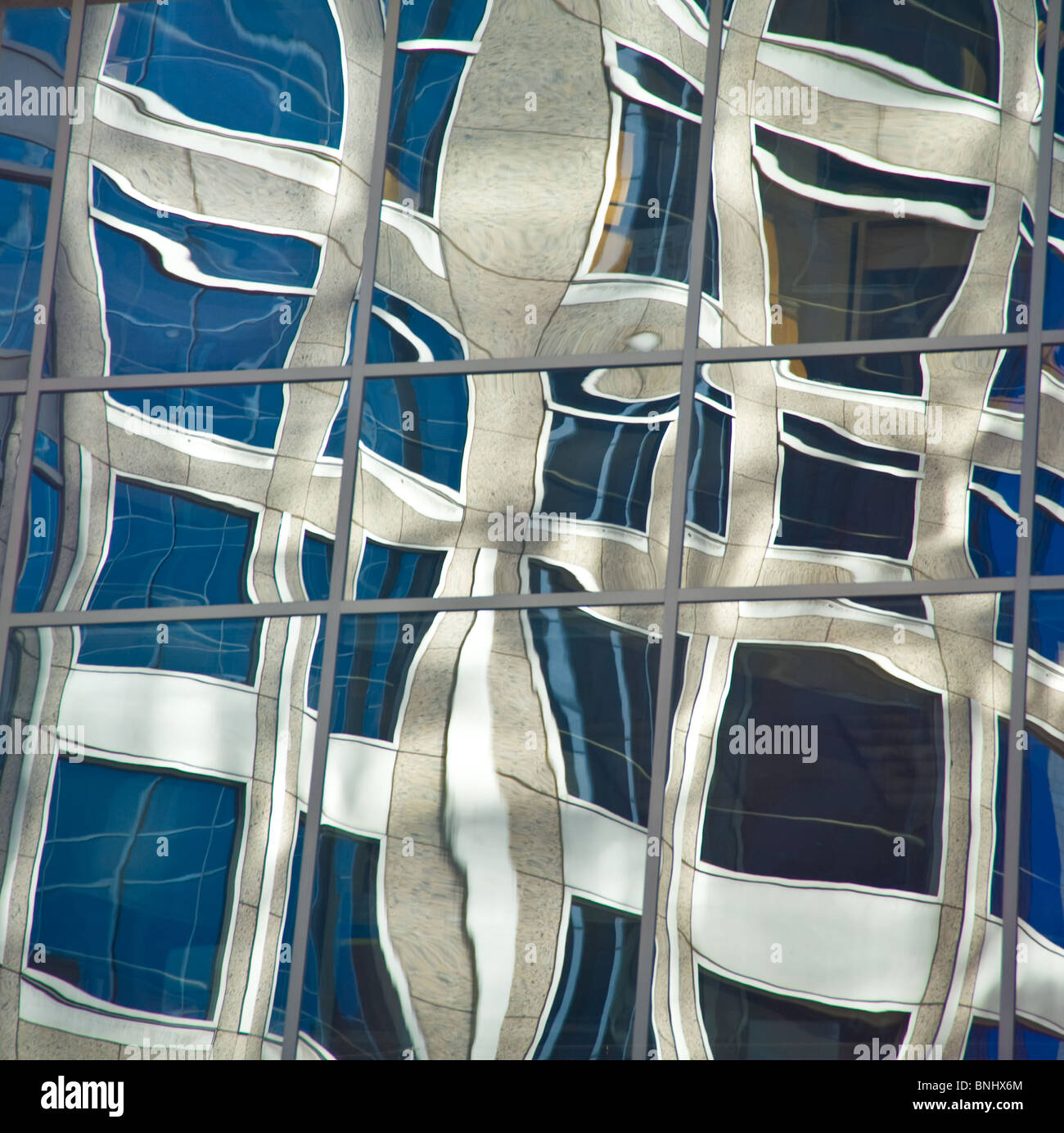 reflection in windows of building glass mirror effect pattern center of ...