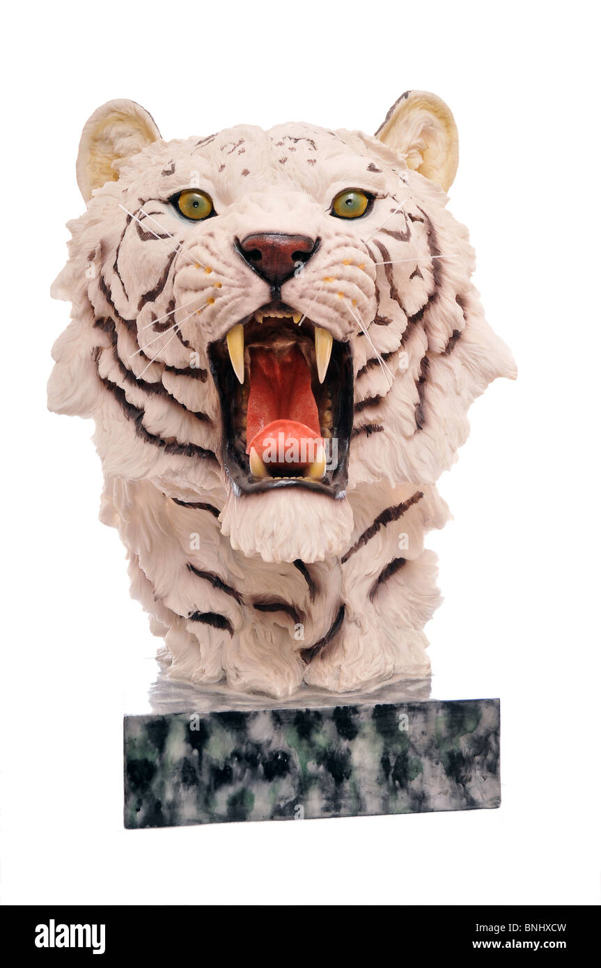 White plastic tiger head on marble rock isolated on white Stock Photo ...