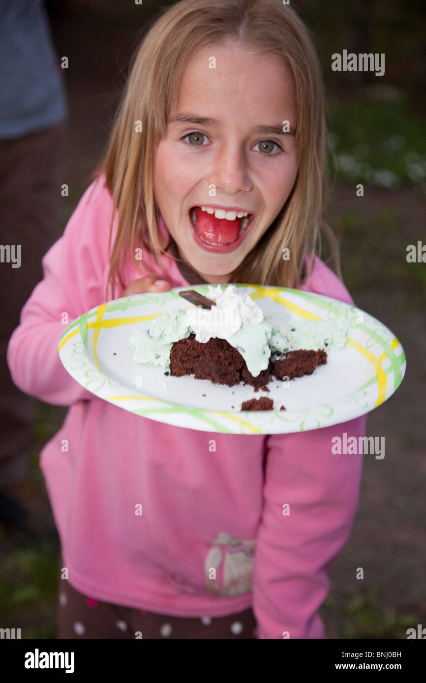 Girl eating dessert Stock Photo - Alamy