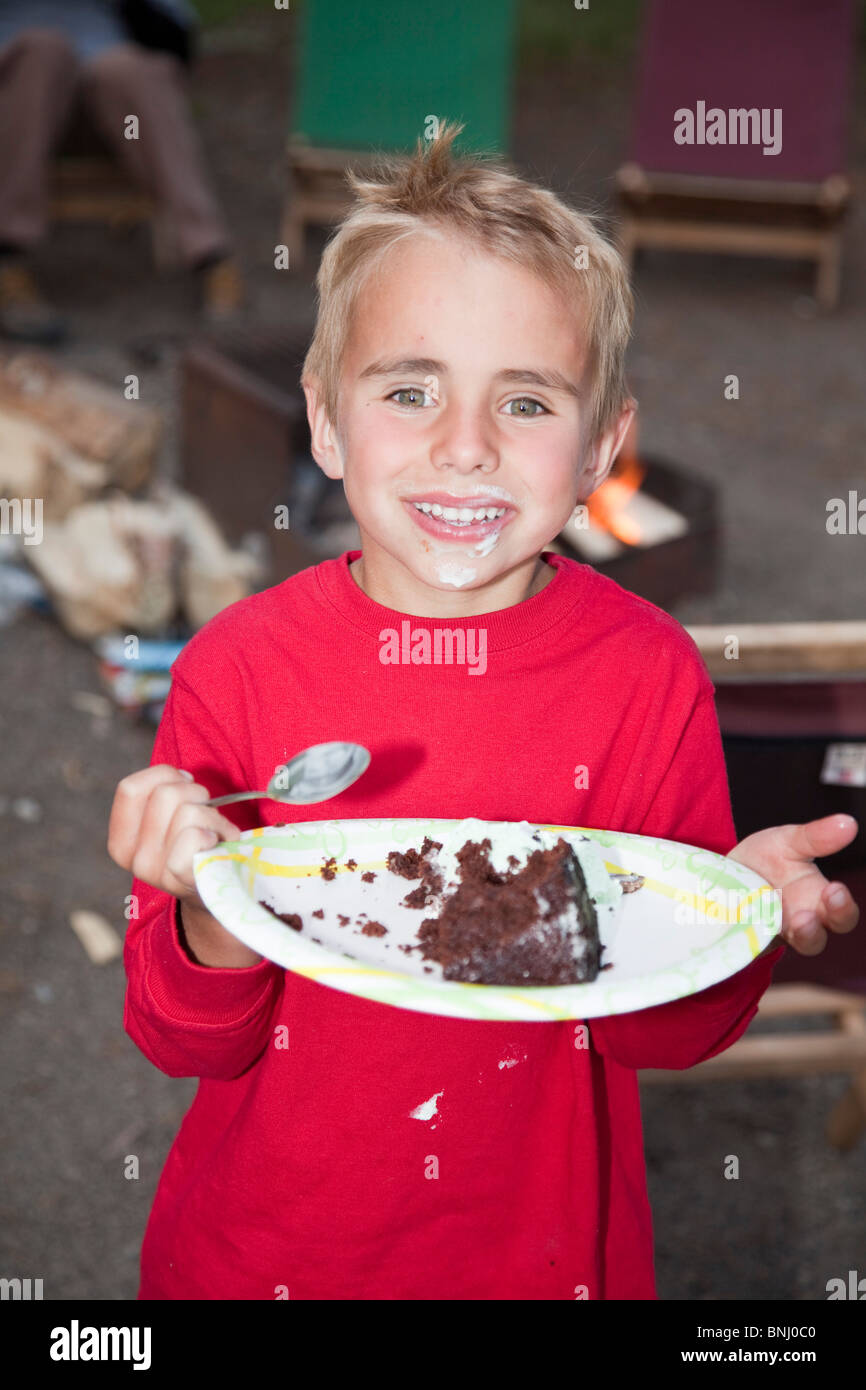 Boy eating dessert Stock Photo - Alamy
