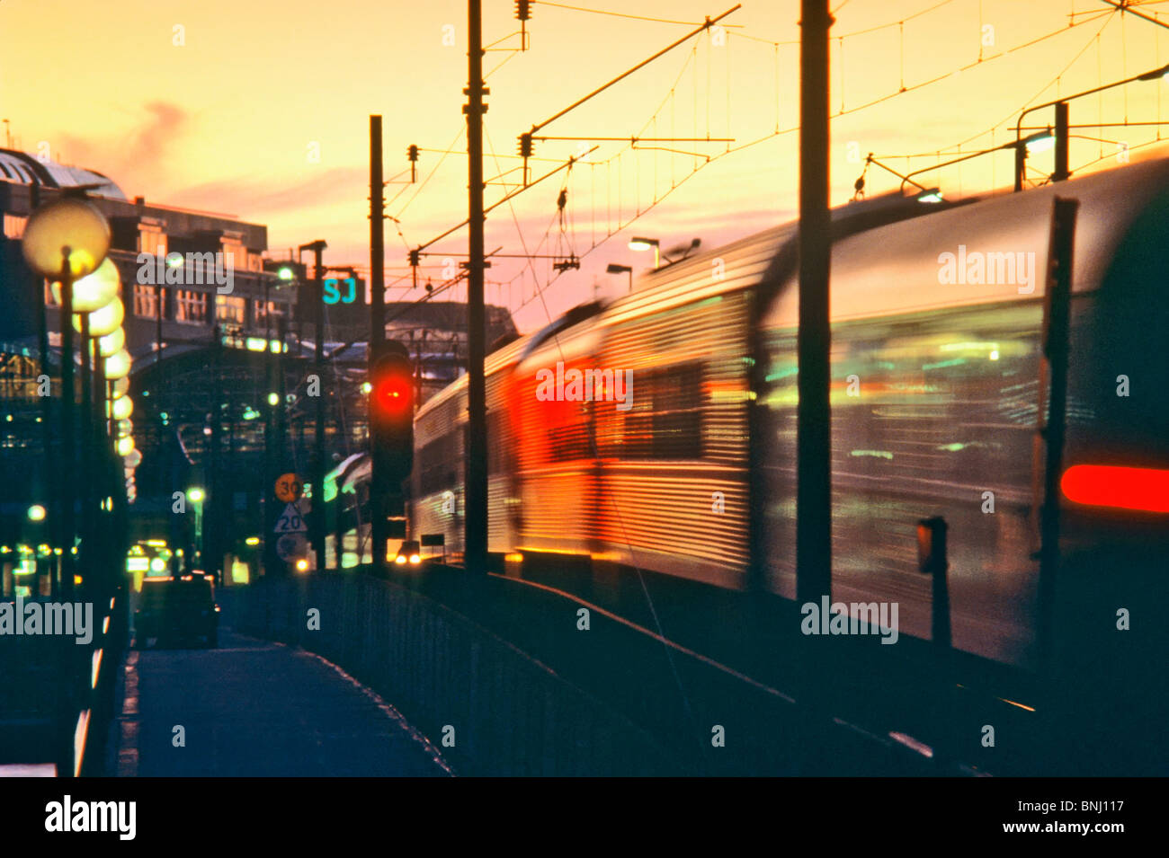 Sweden Scandinavia railroad train feature traffic lights in evening ...
