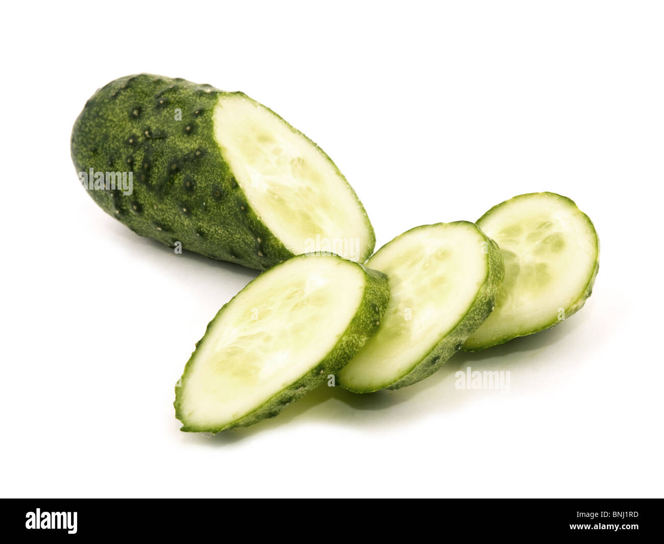 Sliced fresh cucumber on white background Stock Photo - Alamy