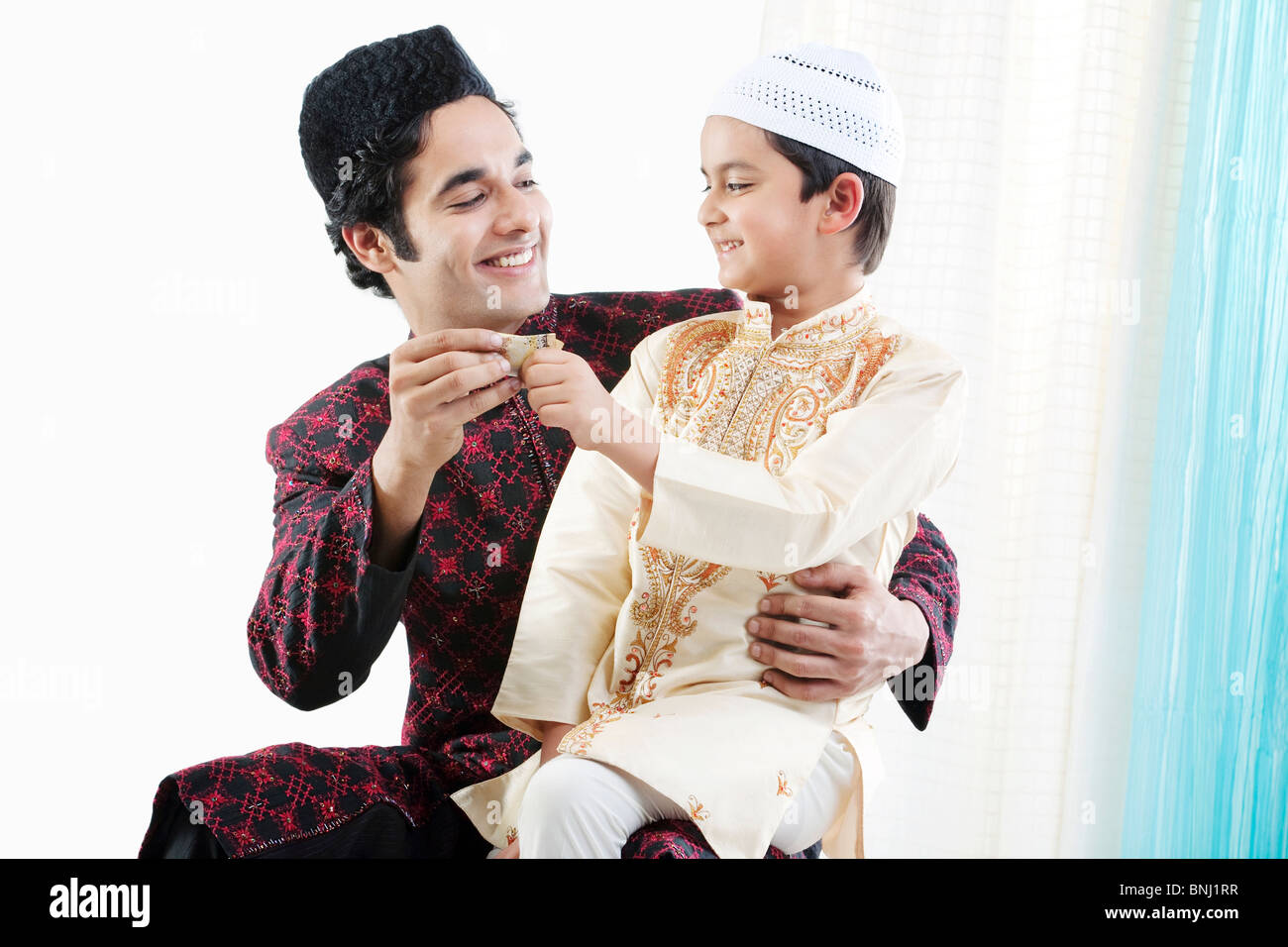 Muslim father and son Stock Photo - Alamy