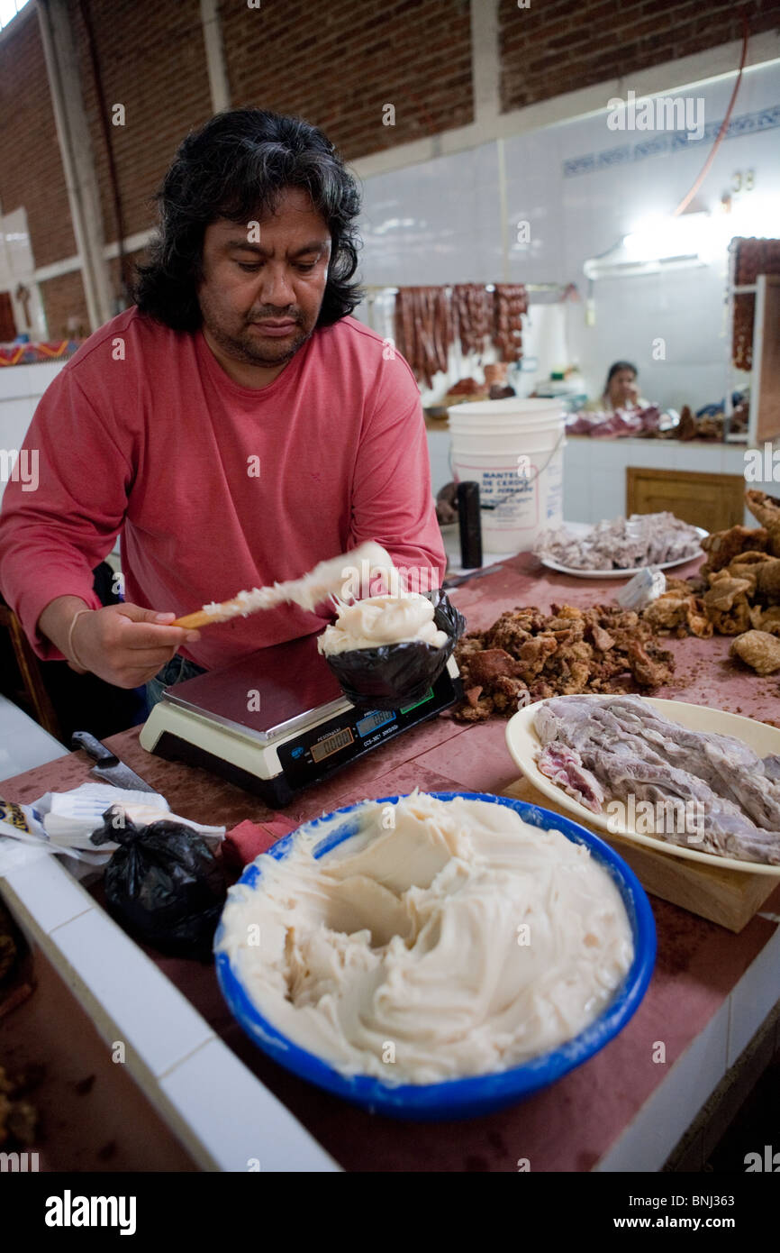 A man selling grease in San Cristobal de las Casas market, Chiapas ...