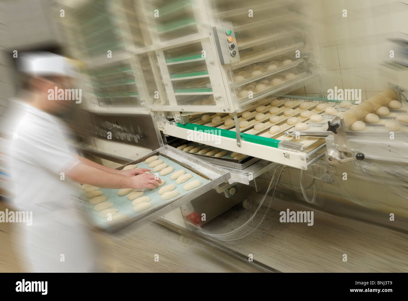 pastry process to bread, machine preparing pastry to bread rolls blanks ...