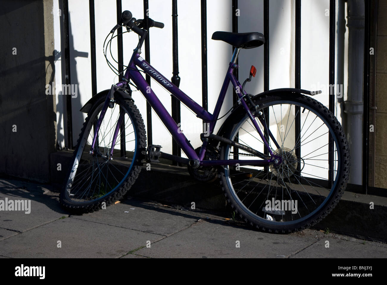 Bicycle with buckled (vandalised?) front wheel chained to railings in ...