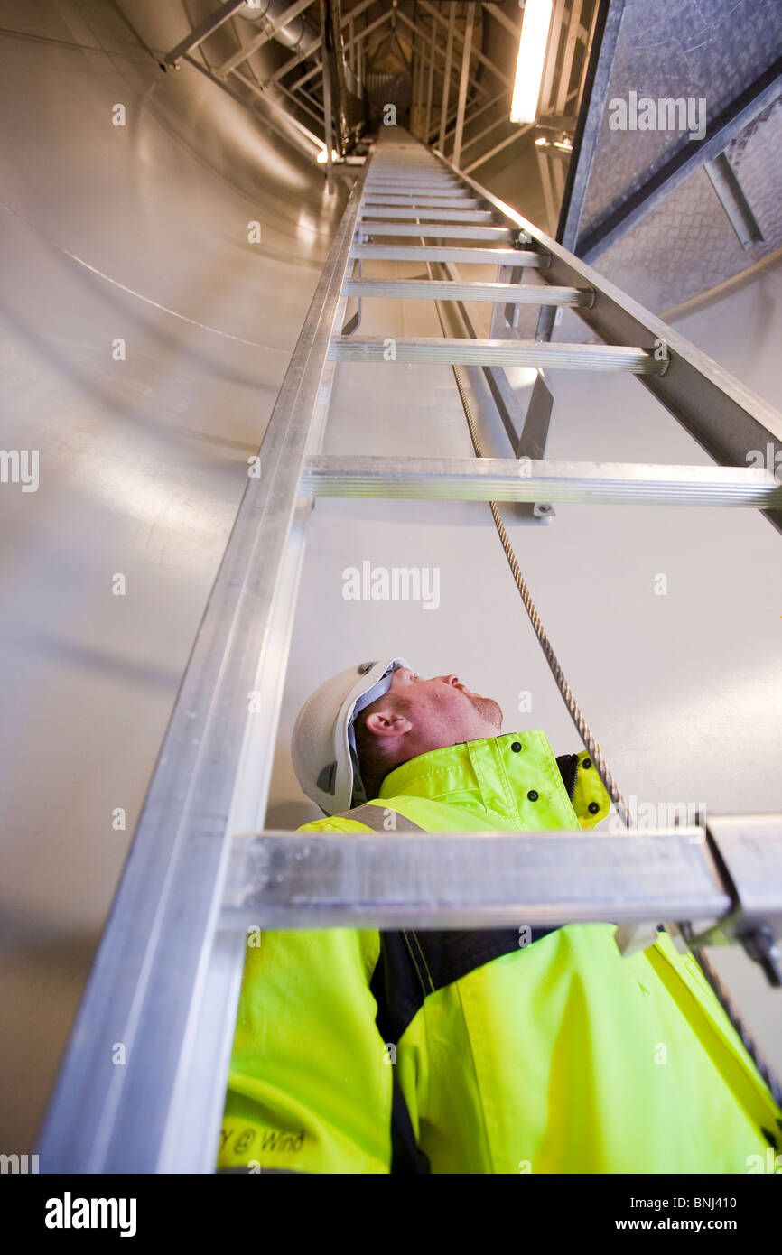 An engineer climbs the ladder of a Siemens wind turbine tower, destined ...