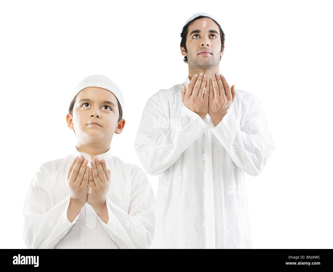Muslim man and his son praying Stock Photo - Alamy