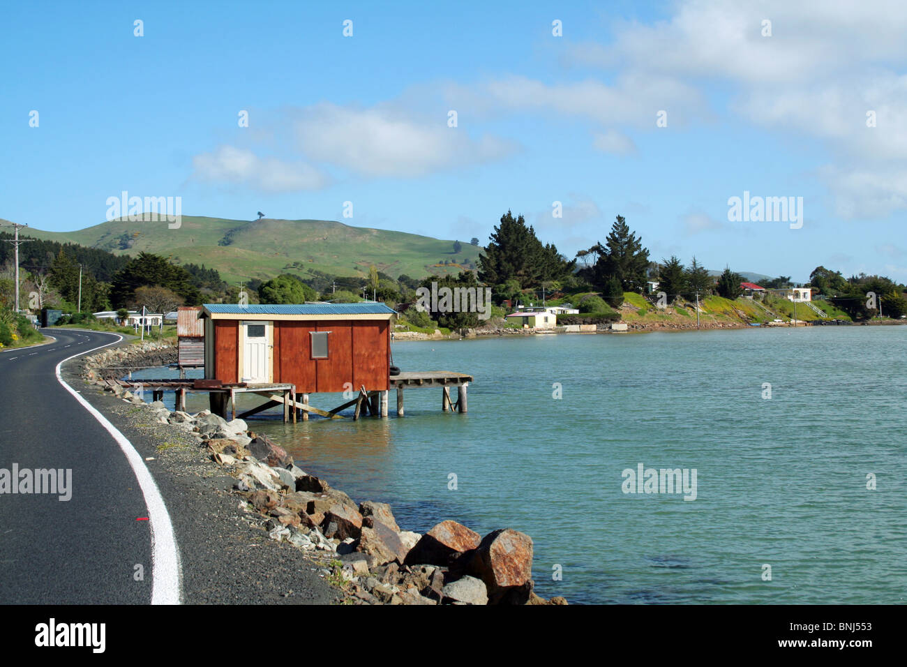 Road along a bay in New Zealand Stock Photo - Alamy