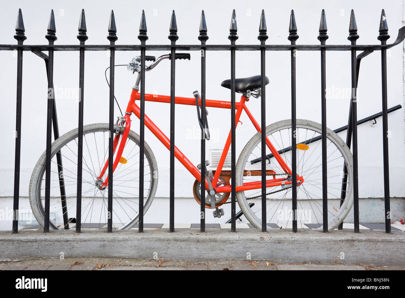 Cycle locked to railing hi-res stock photography and images - Alamy