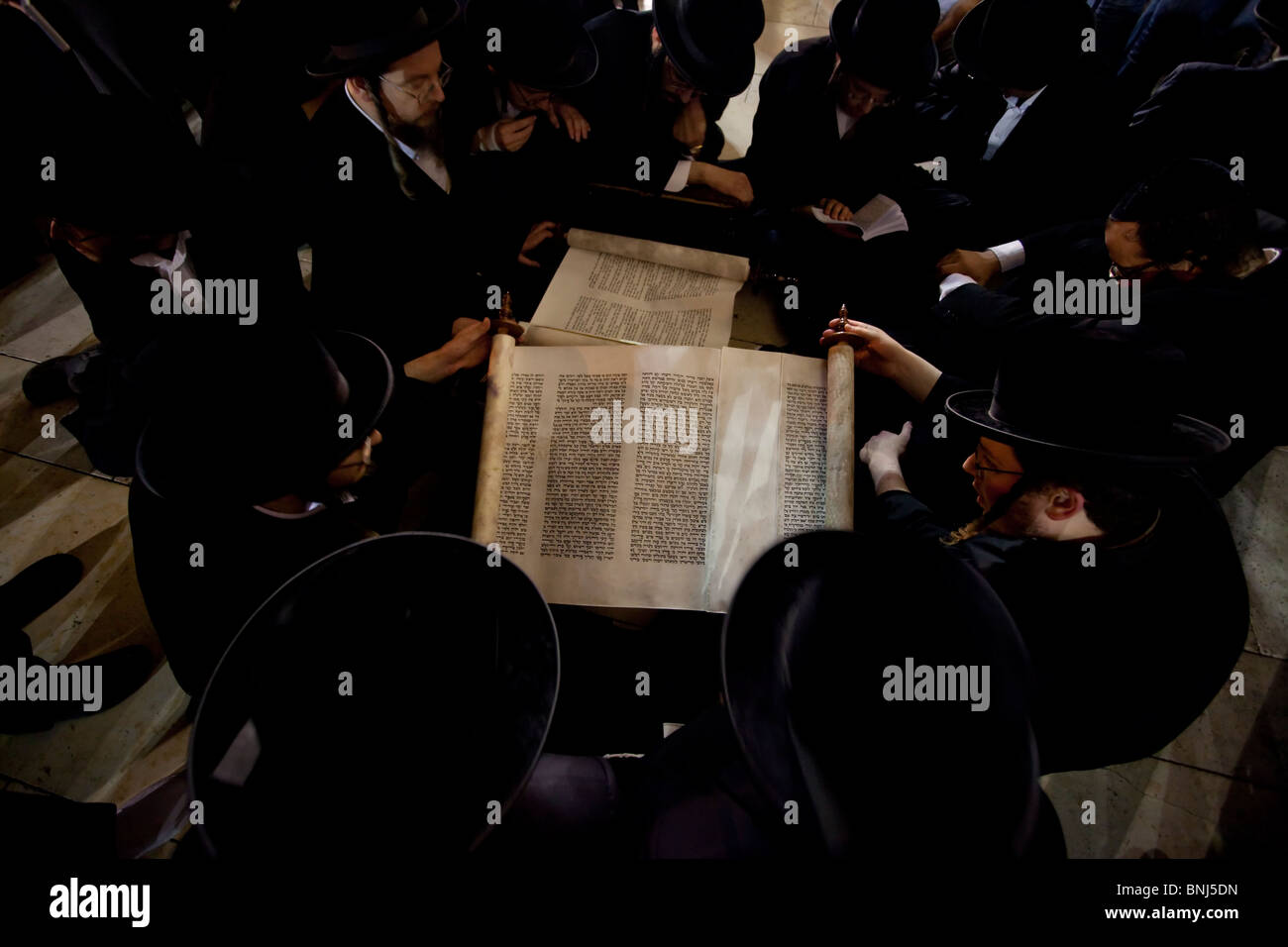 Ultra Orthodox Jews read from a Torah scroll the biblical Book of ...