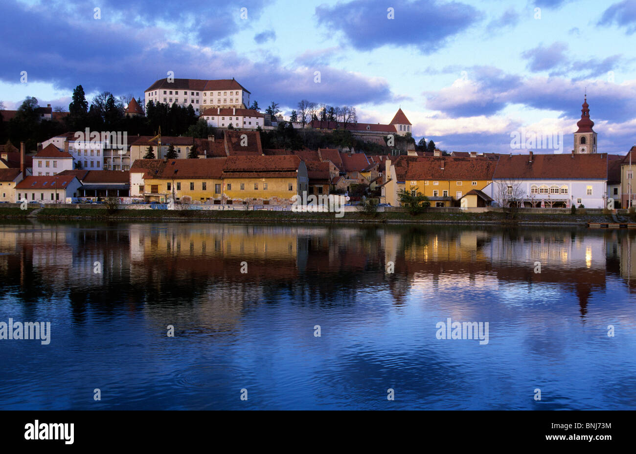 Slovenia town city river stream Drava Old Town castle evening light ...