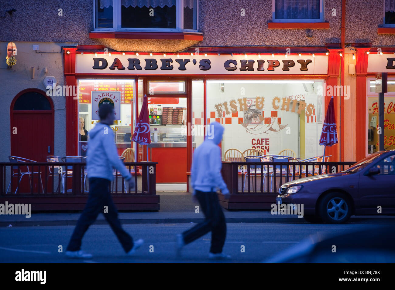 A fish and chip shop in Rhyl, at night, North Wales Stock Photo - Alamy
